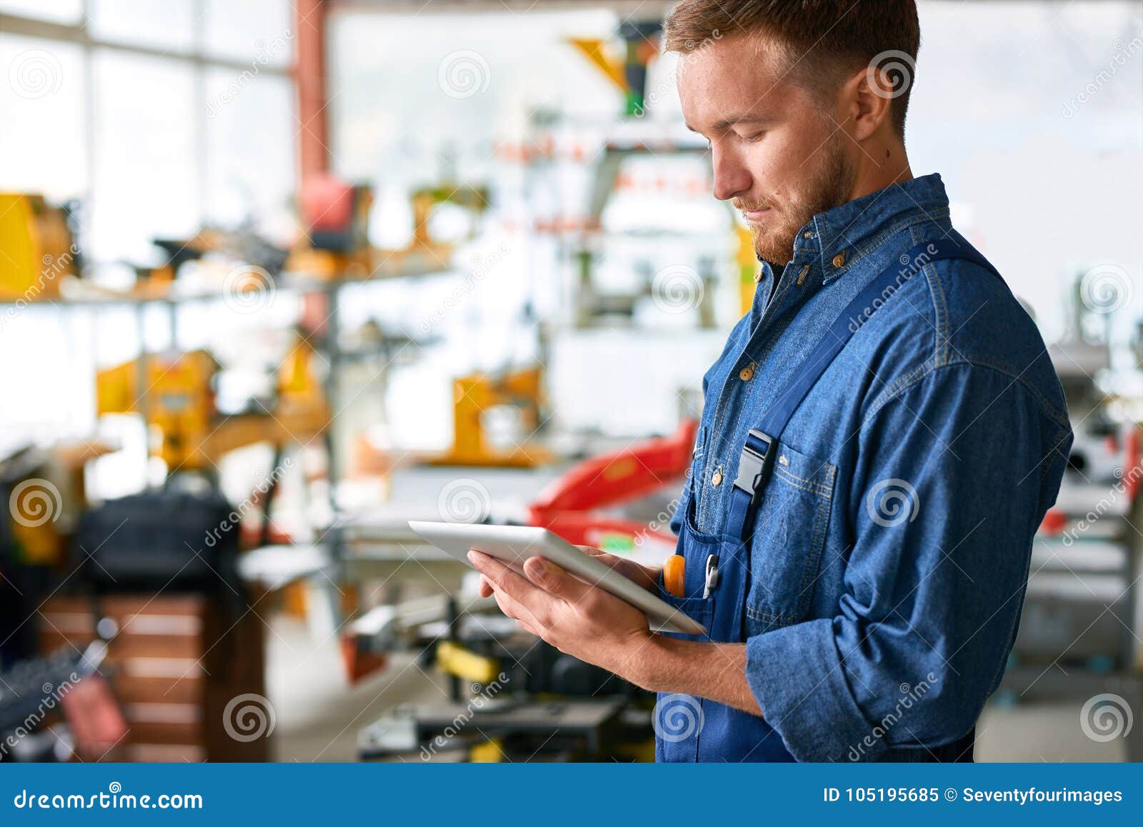 Young Worker Using Digital Tablet at Factory Stock Image - Image of ...