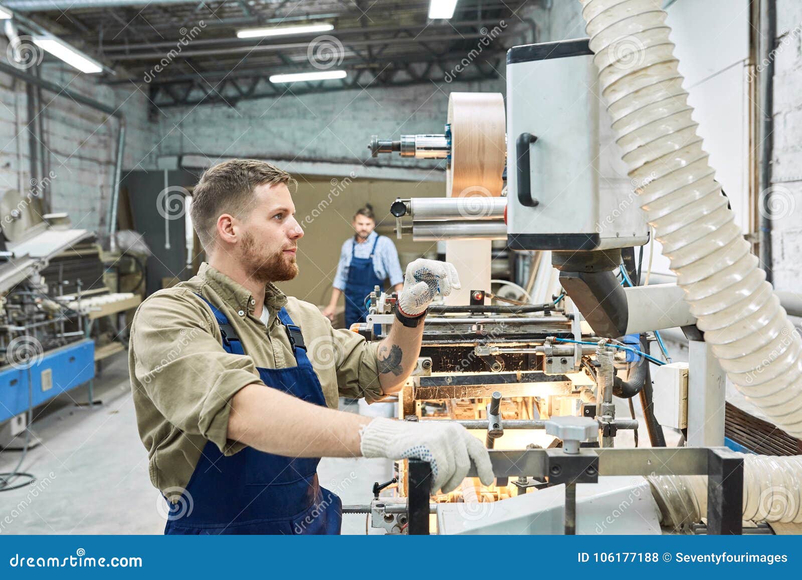 Young Worker Using Machine at Factory Stock Photo - Image of engineer ...