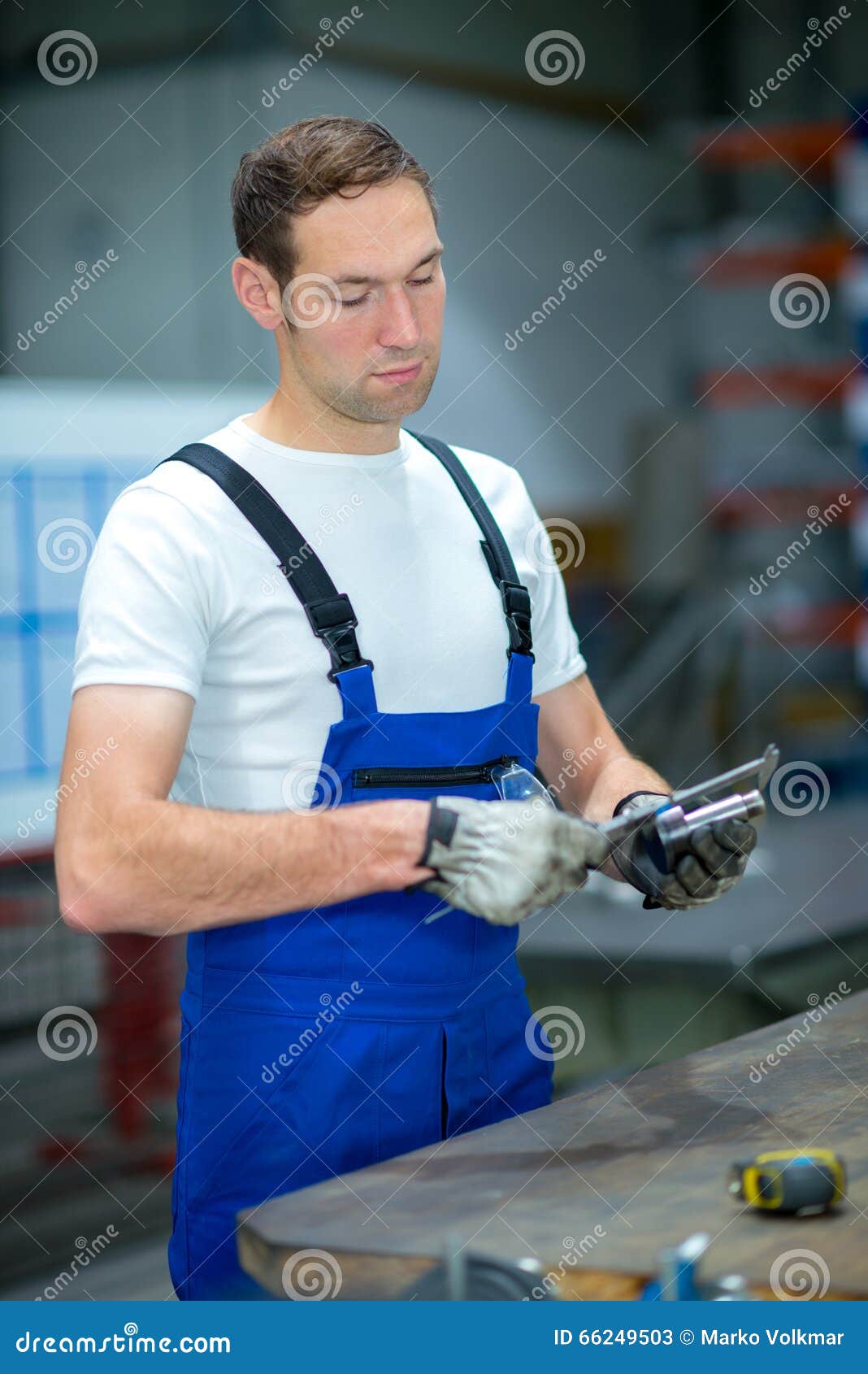 Young Worker on Work Bench in the Factory Stock Image - Image of ...