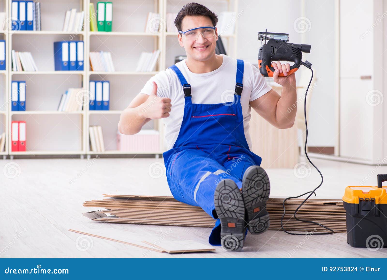 The Young Worker Working on Floor Laminate Tiles Stock Photo - Image of ...