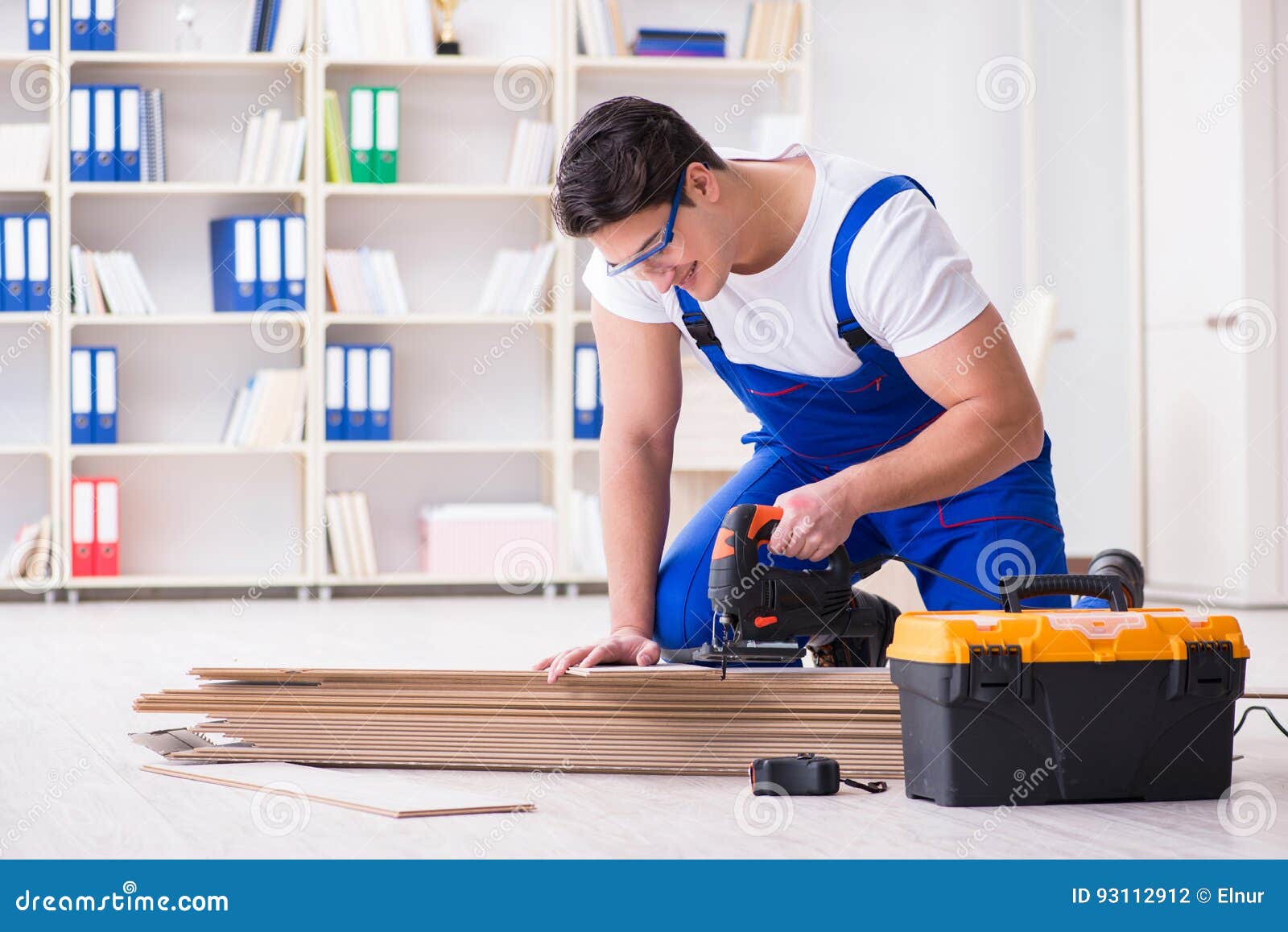 The Young Worker Working on Floor Laminate Tiles Stock Photo - Image of ...