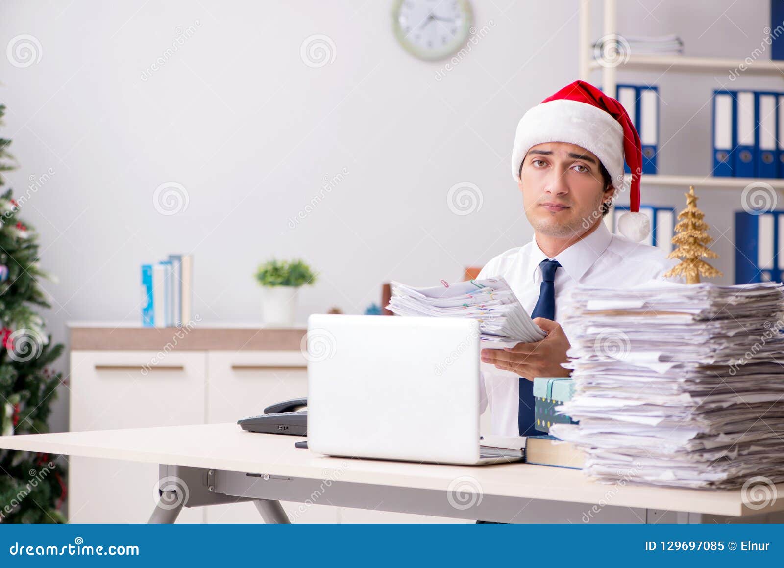 The Young Worker Working in Office on Christmas Shift Stock Image ...