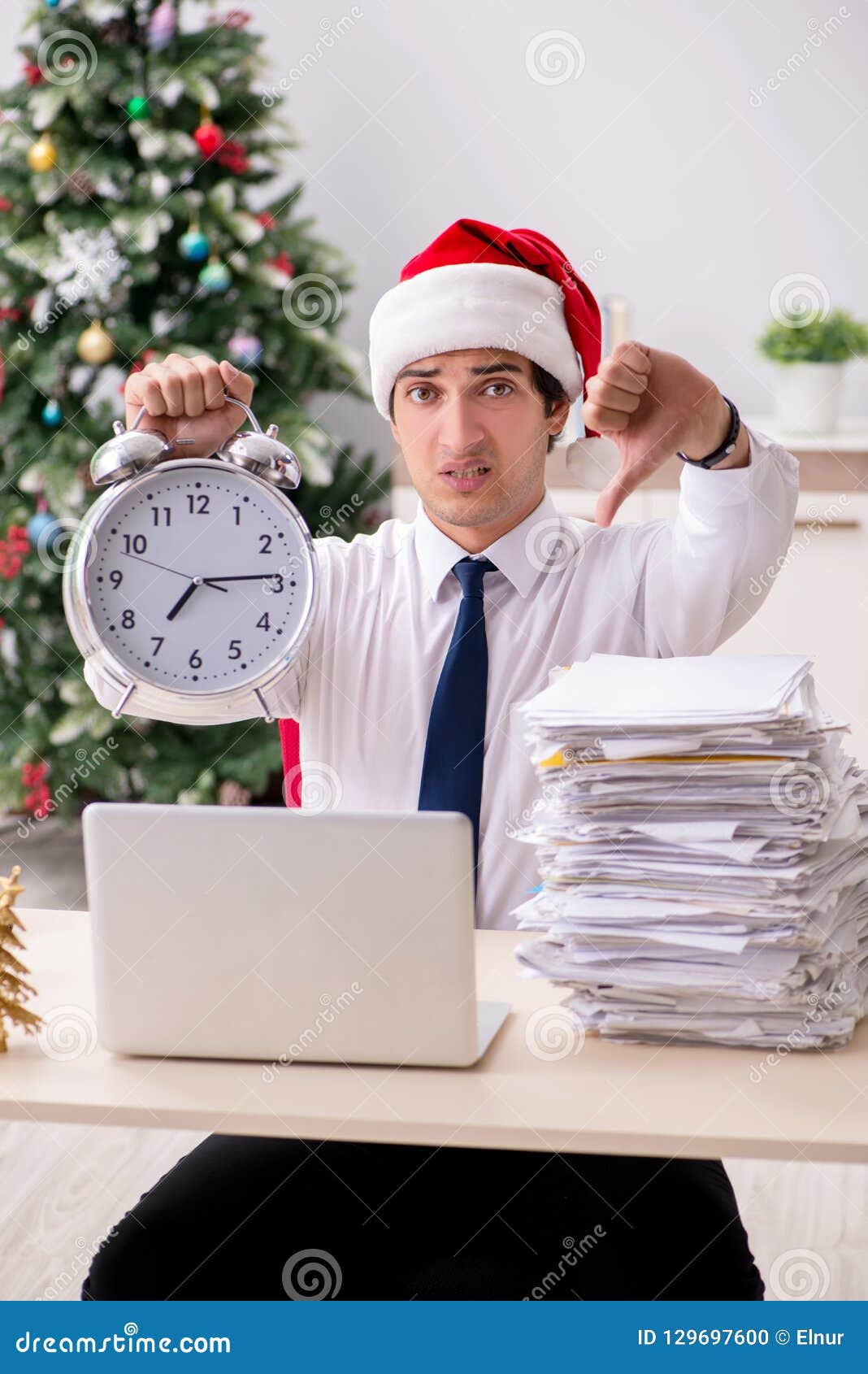 The Young Worker Working in Office on Christmas Shift Stock Photo ...