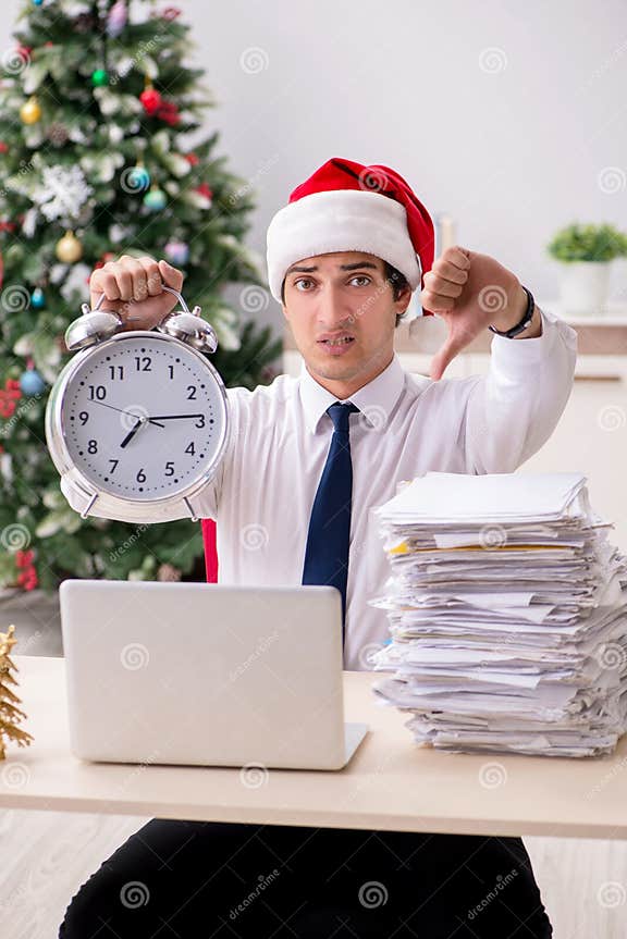 The Young Worker Working in Office on Christmas Shift Stock Photo ...