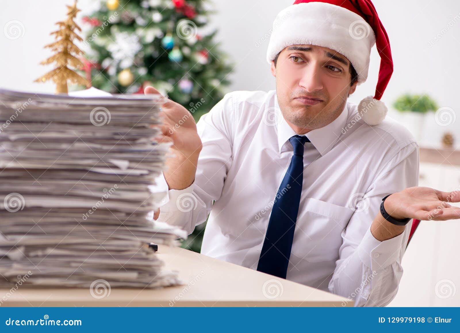 The Young Worker Working in Office on Christmas Shift Stock Photo ...