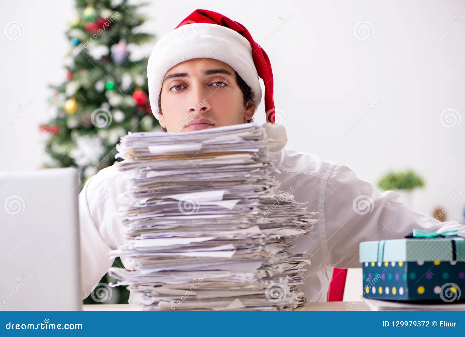 The Young Worker Working in Office on Christmas Shift Stock Photo ...