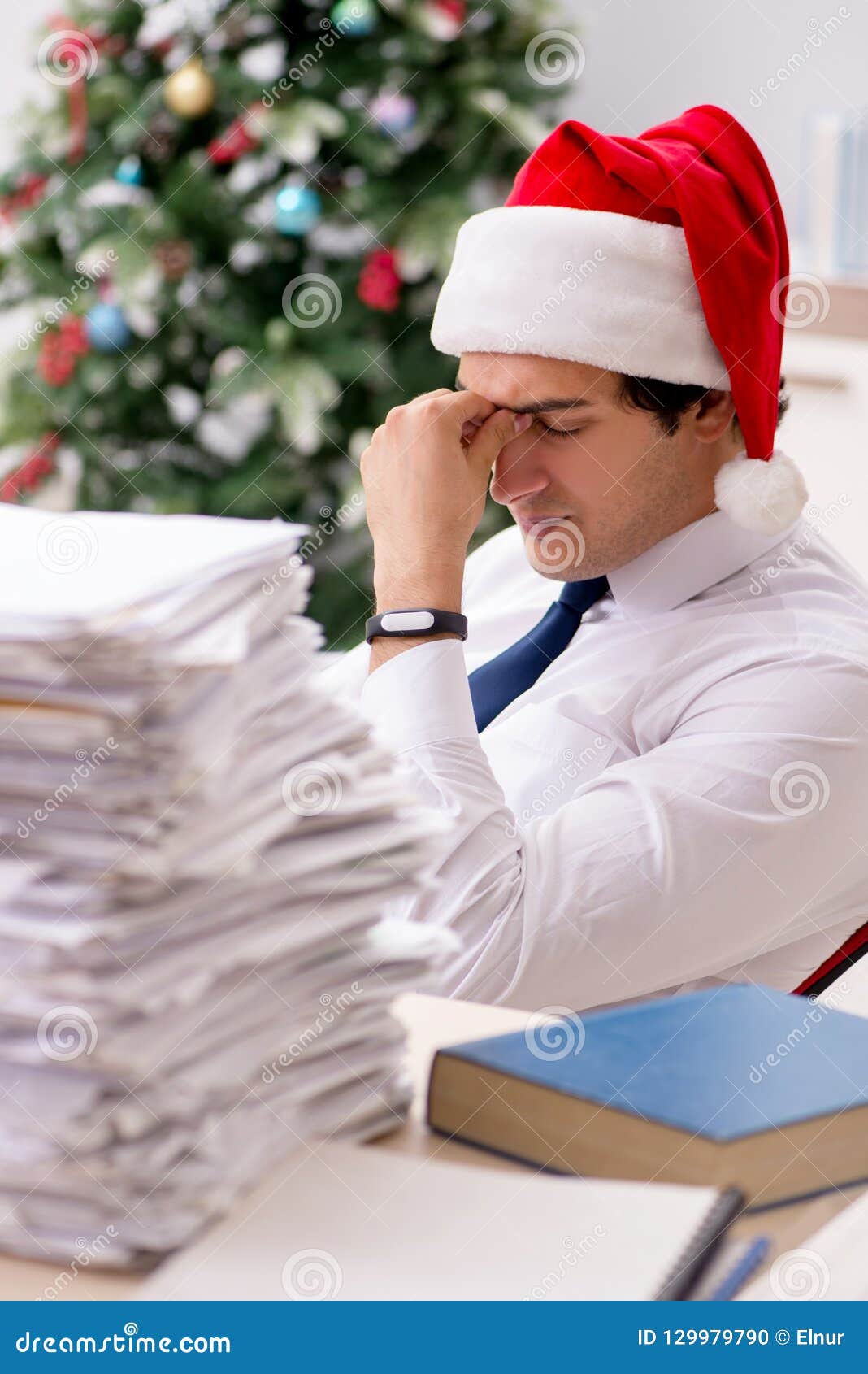 The Young Worker Working in Office on Christmas Shift Stock Photo ...