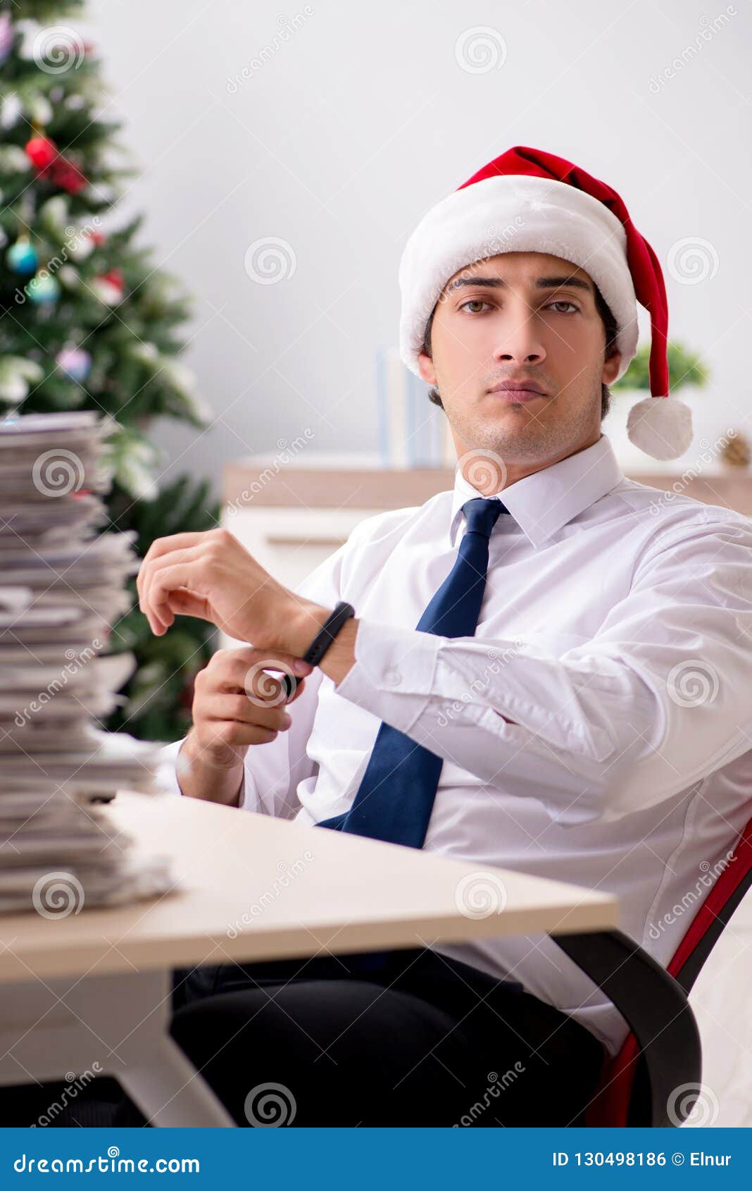 The Young Worker Working in Office on Christmas Shift Stock Photo ...