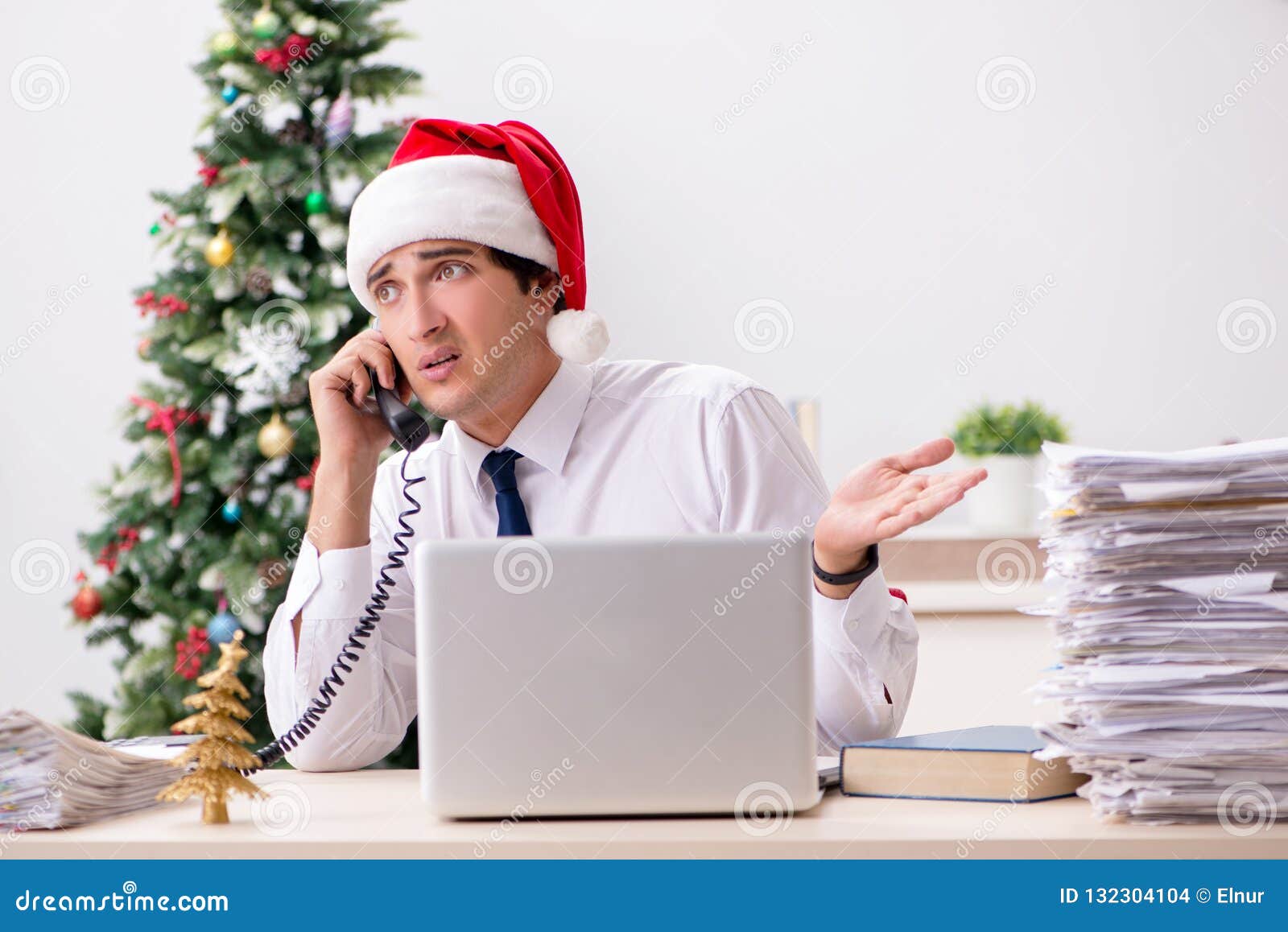 The Young Worker Working in Office on Christmas Shift Stock Photo ...