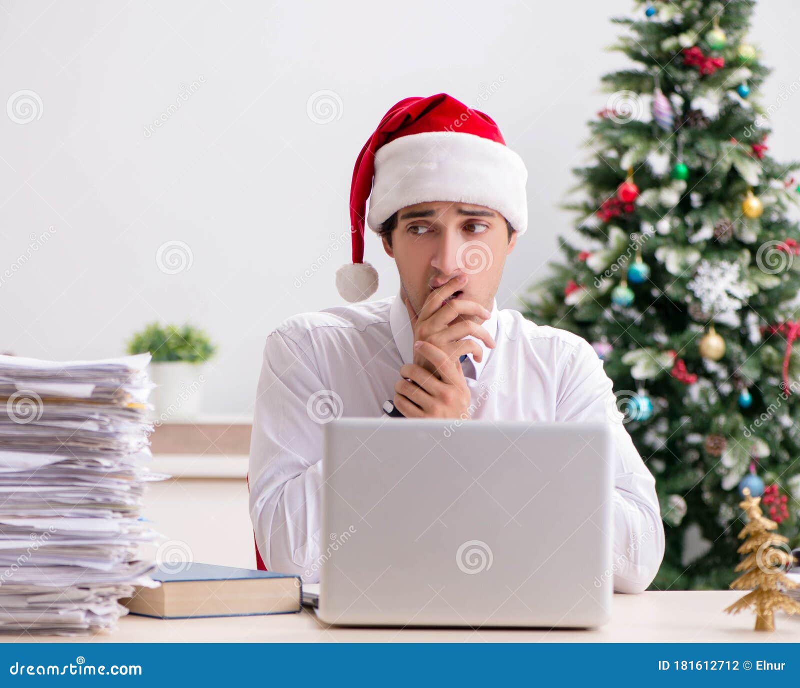 Young Worker Working in Office on Christmas Shift Stock Photo - Image ...