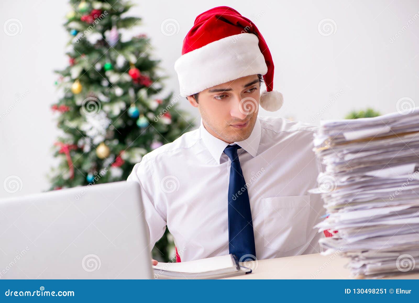 The Young Worker Working in Office on Christmas Shift Stock Image ...