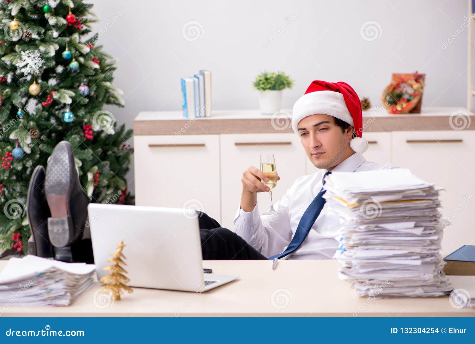 The Young Worker Working in Office on Christmas Shift Stock Photo ...