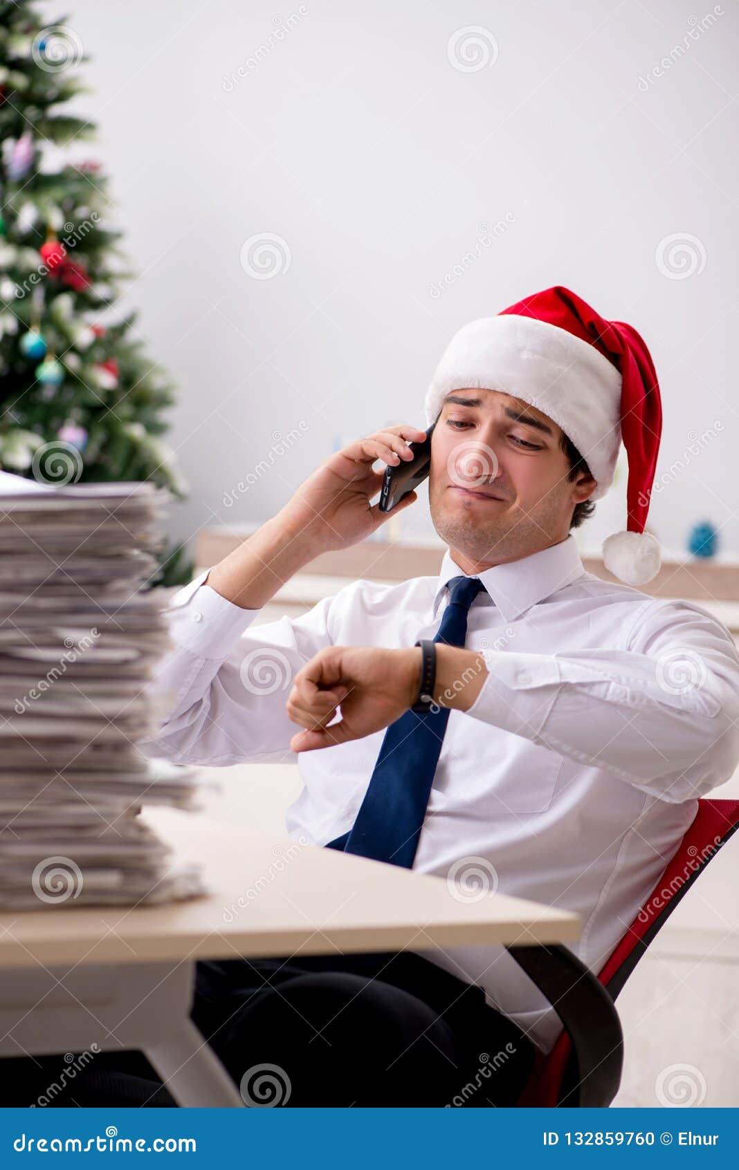 The Young Worker Working in Office on Christmas Shift Stock Photo ...