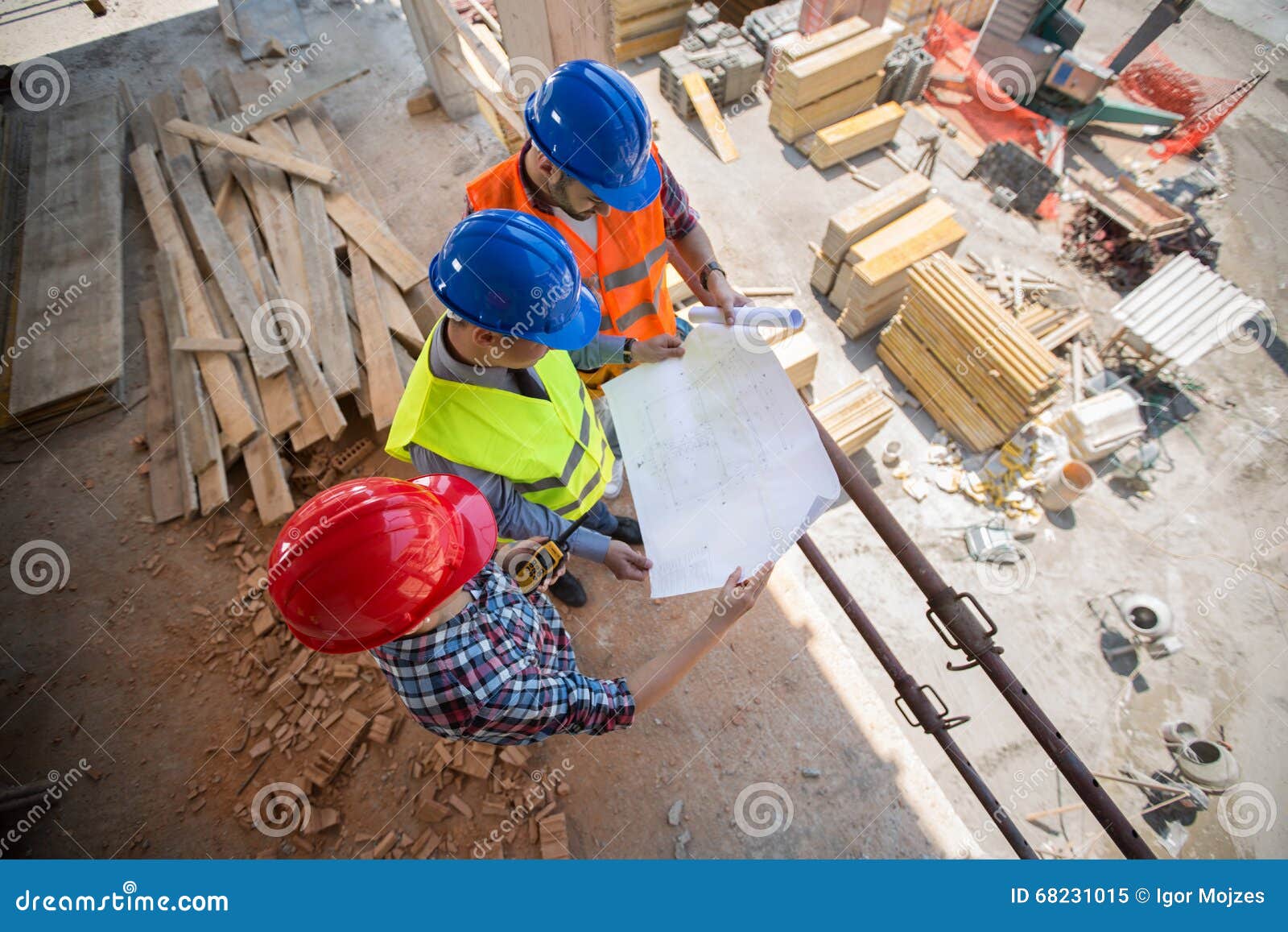 Young Workers Checking Blue Print at Building Place Stock Image - Image ...