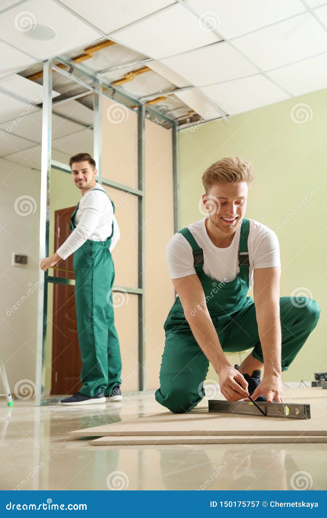 Young Workers Installing Drywall. Home Repair Service Stock Image ...