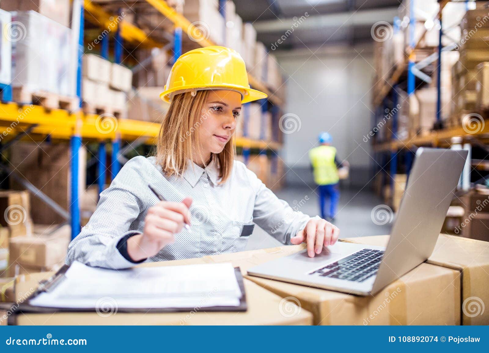 Young Warehouse Workers with Laptop Working. Stock Photo - Image of ...