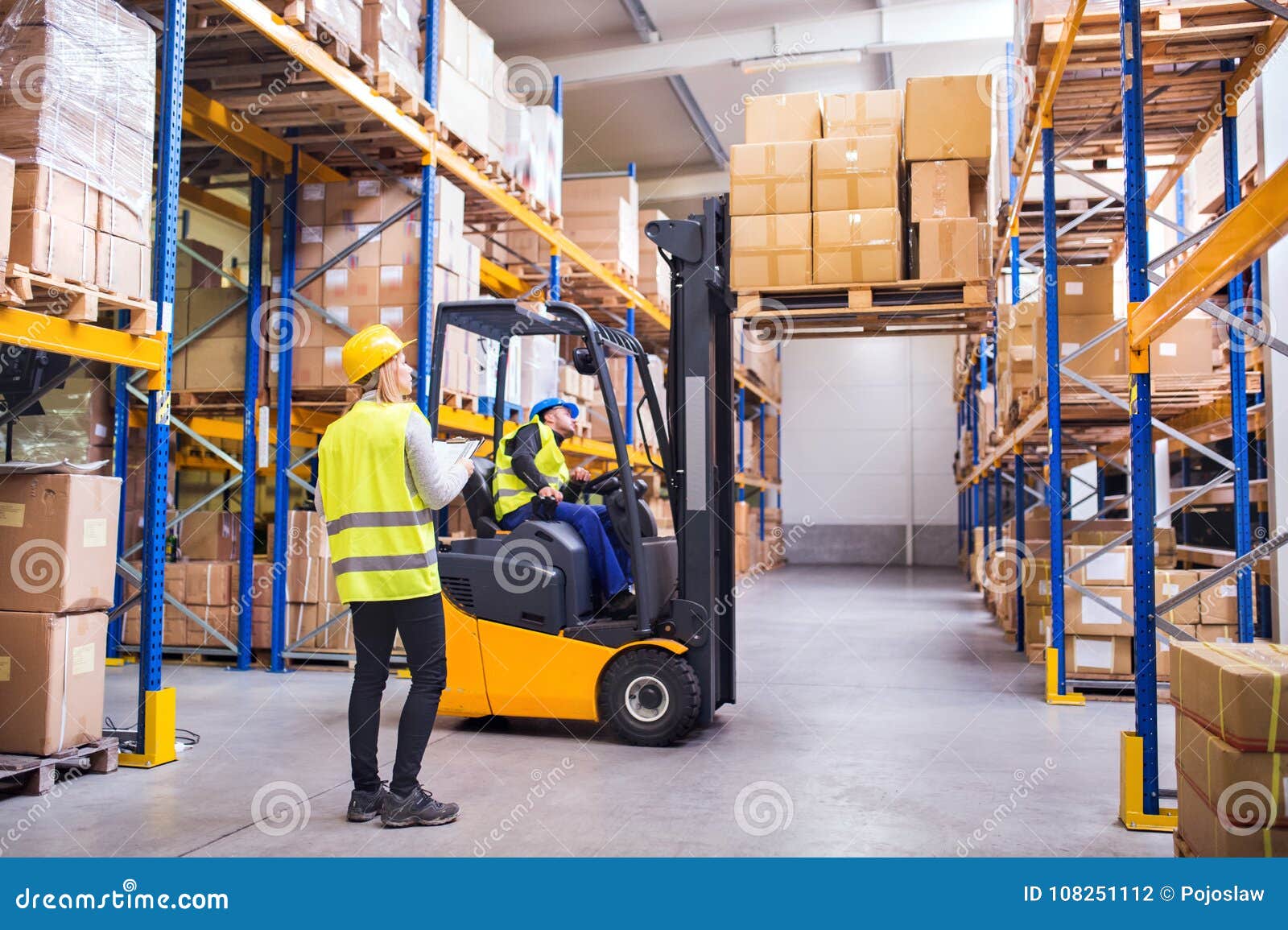 Young Warehouse Workers Working Together. Stock Photo - Image of ...