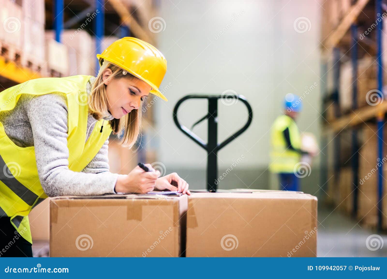 Young Workers Working in a Warehouse. Stock Image - Image of shelves ...