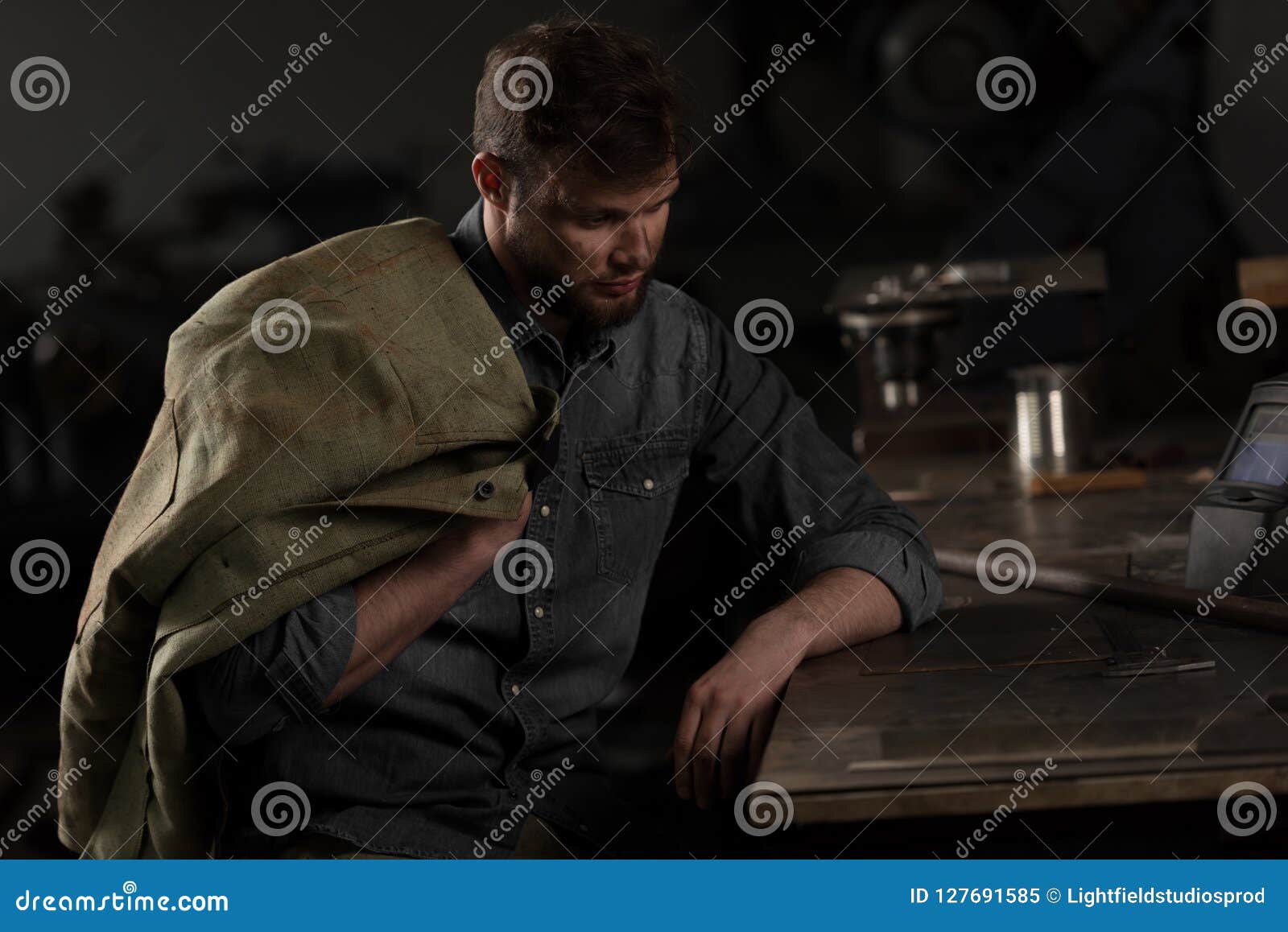 Young Workman Sitting at Table with Uniform Stock Image - Image of ...