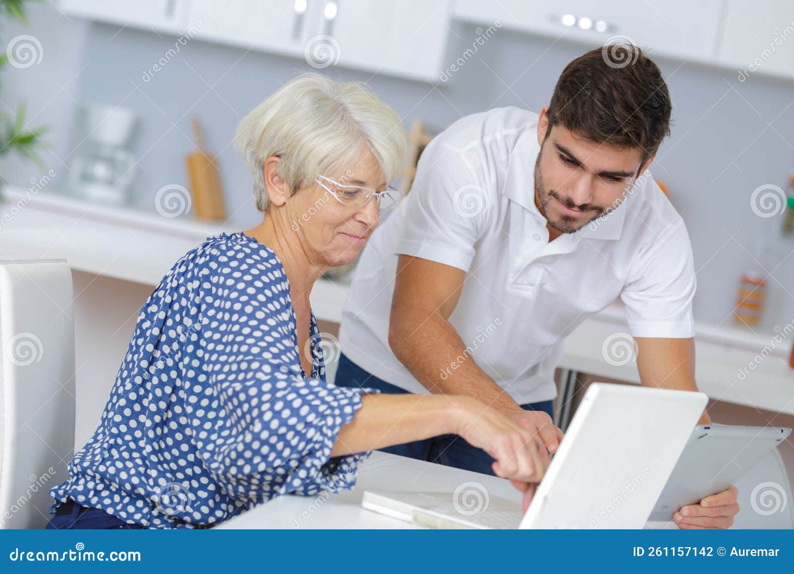 Youngerman Helping Elderly Person Using Laptop Computer Stock Photo ...