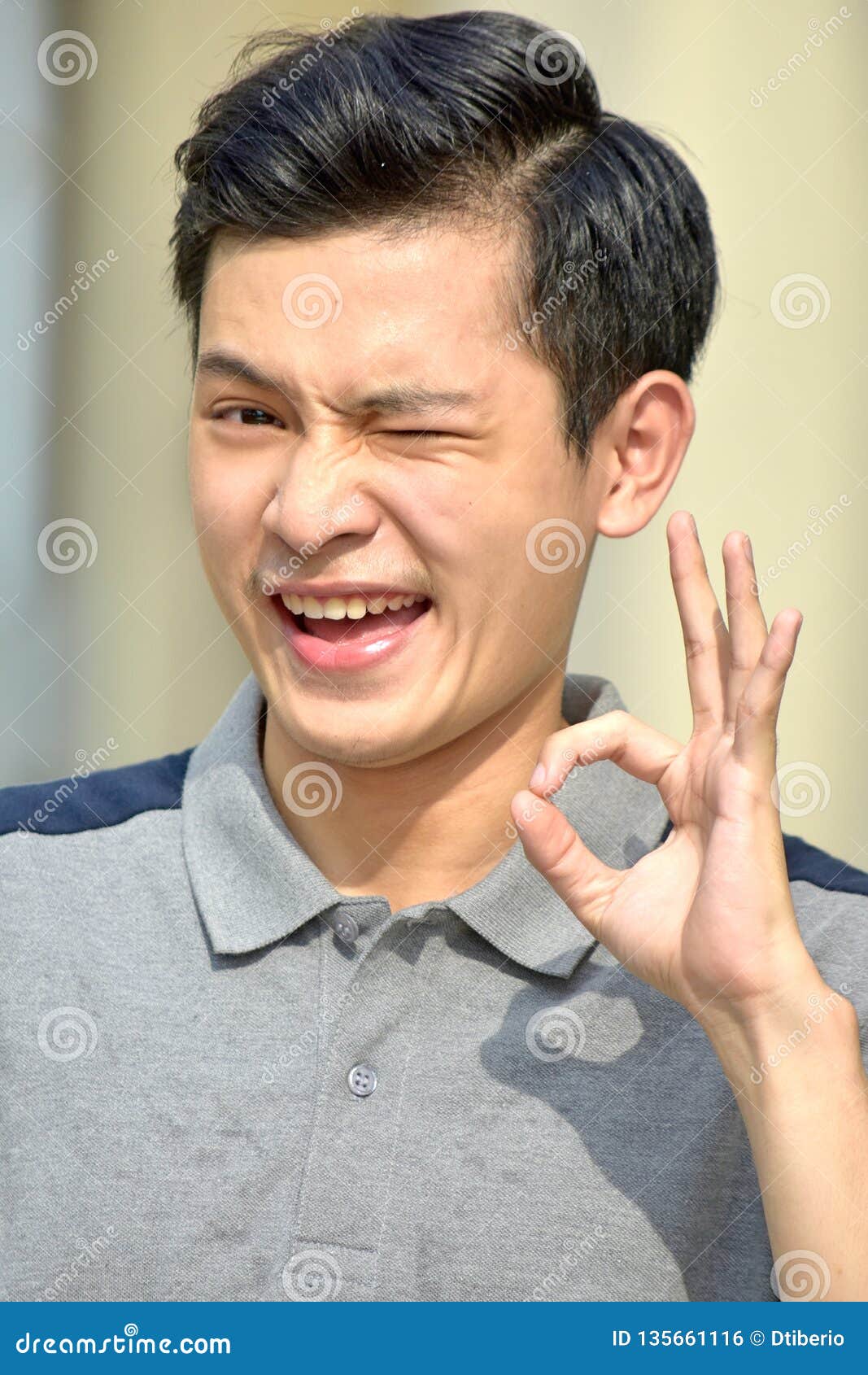 Youngster and Okay Sign stock photo. Image of youngster - 135661116