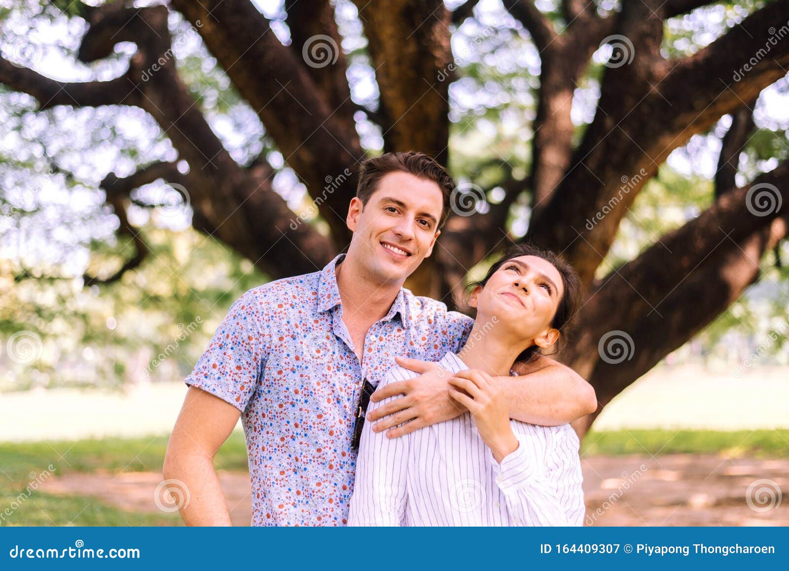 Younh Couple In Love Hugging Each Other At Park Romantic And Enjoying
