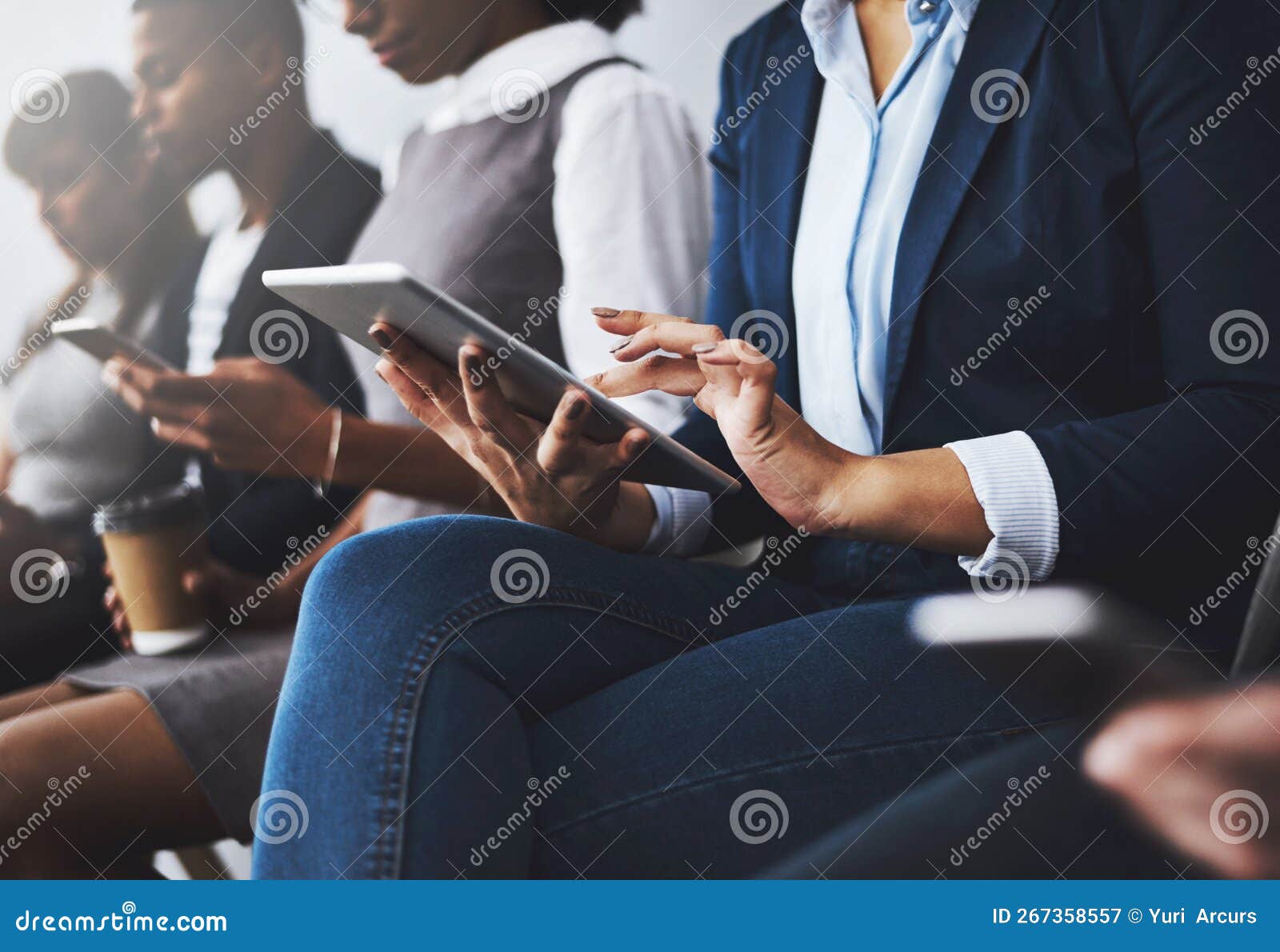 Your Future, in Your Hands. a Group of Young Businesspeople Waiting in ...