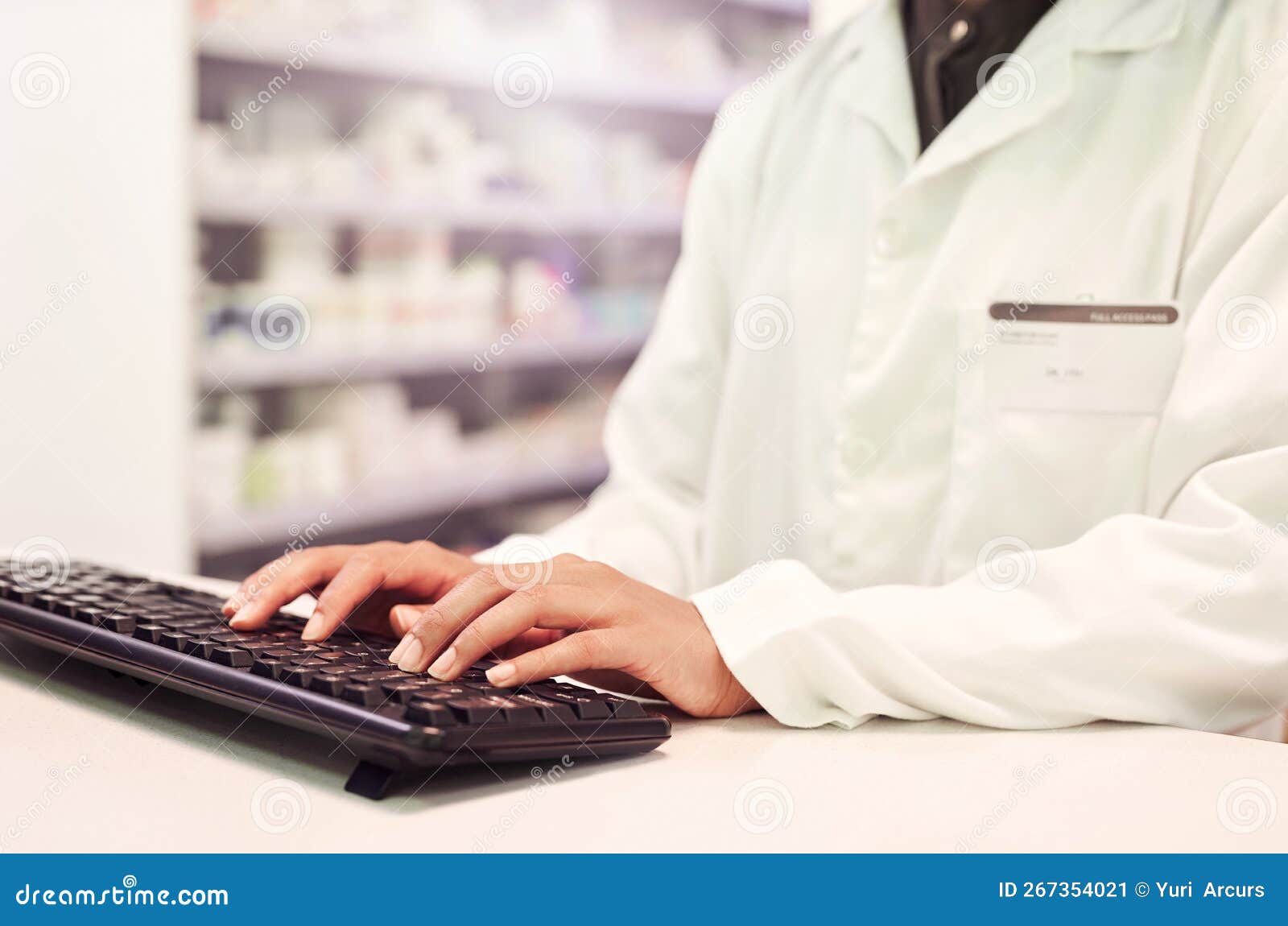 Your Information is Safe with Us. a Pharmacist Working on a Computer in ...