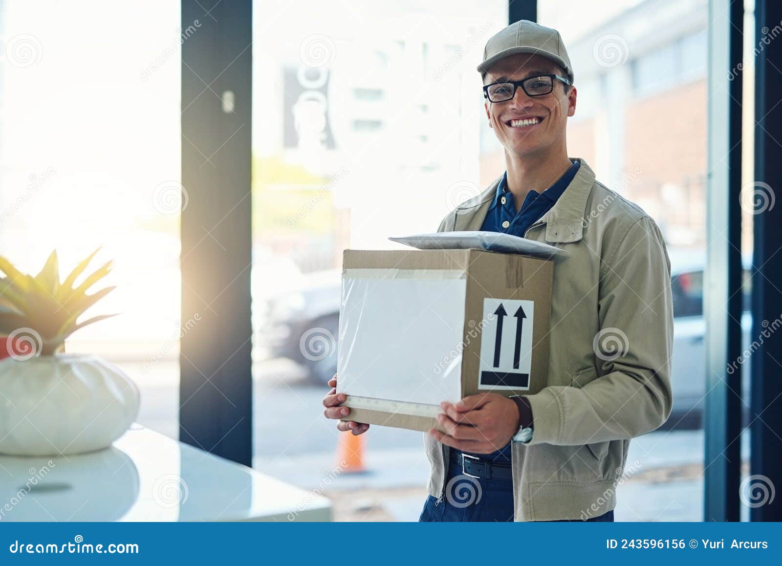 Your Package Has Safely Arrived. Portrait of a Courier Making a ...