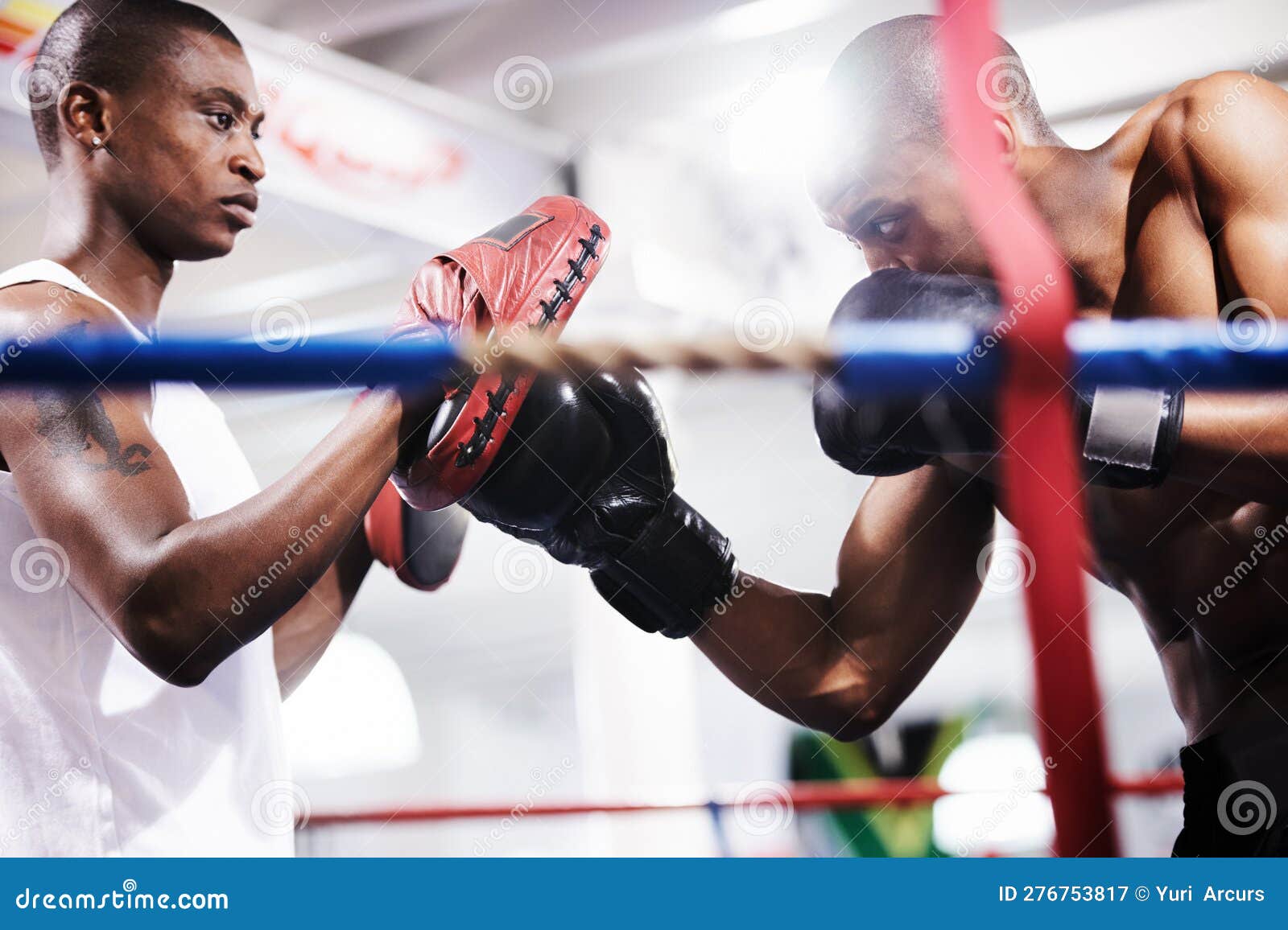 Your Punch Has Power. a Boxer Practicing with His Sparring Partner in ...