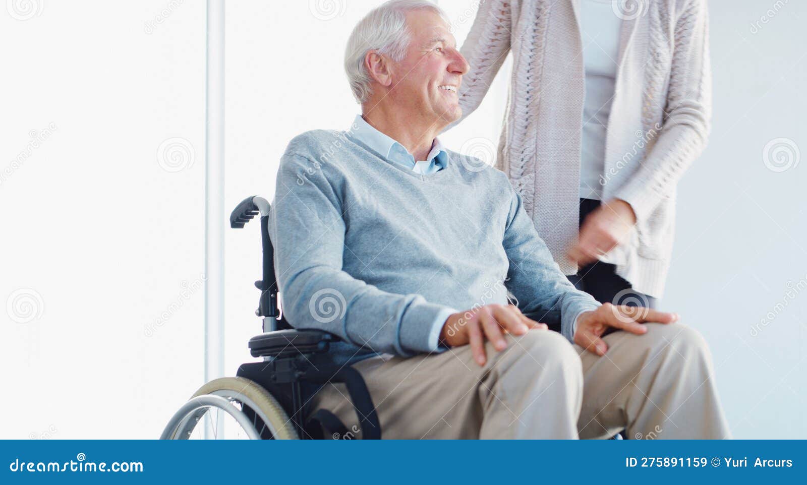 By Your Side Through Our Lives A Senior Man In A Wheelchair Being