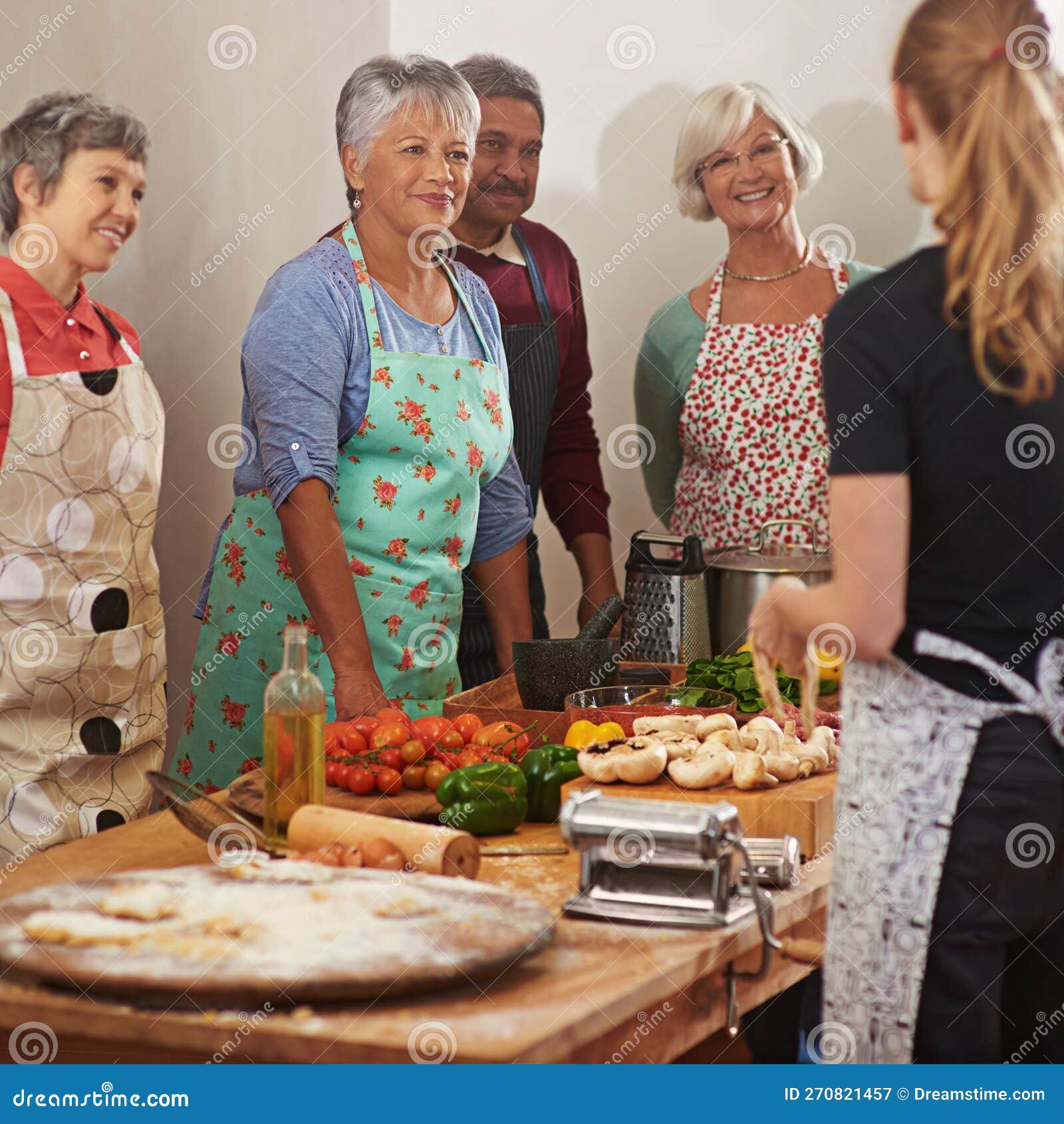 Youre Never Too Old To Learn A Group Of Seniors Attending A Cooking