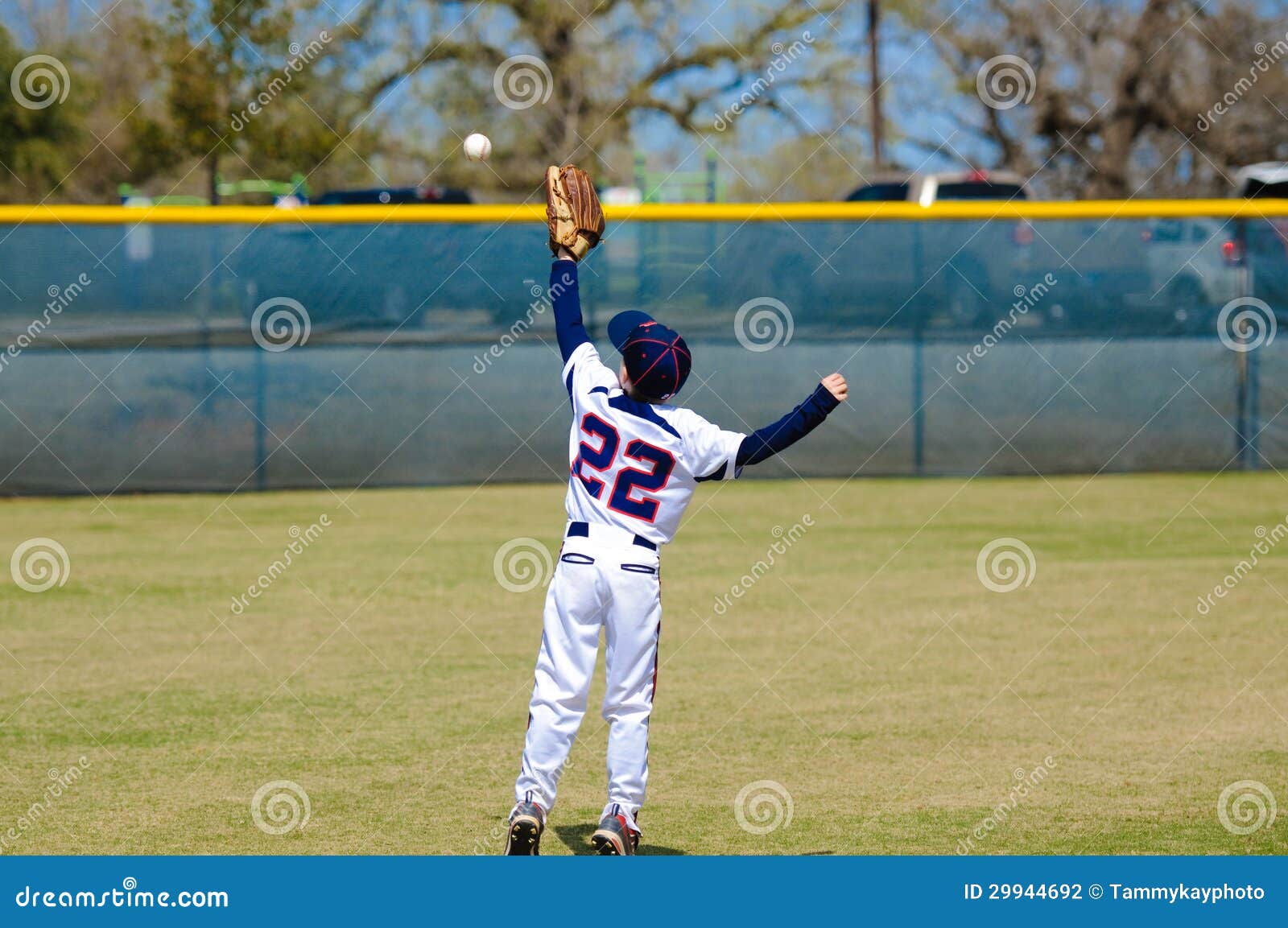 Youth Outfielder Catching Ball Stock Photo - Image of gloves, ball ...