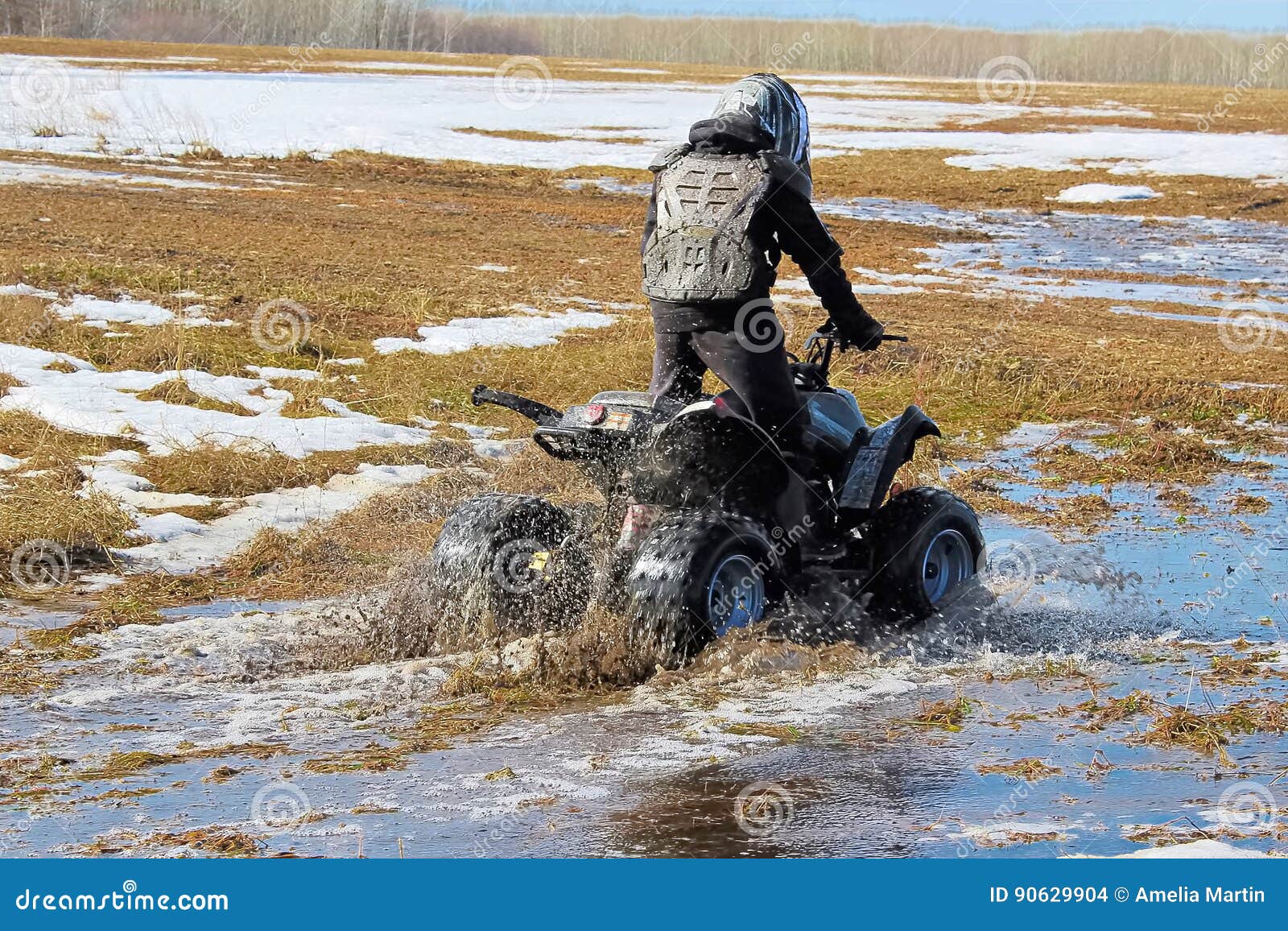 Youth Quading through Spring Run Off Stock Photo - Image of gear ...