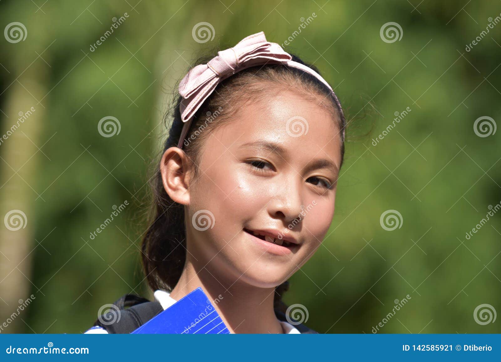 Youthful Minority Female Student Smiling with Notebooks Stock Image ...