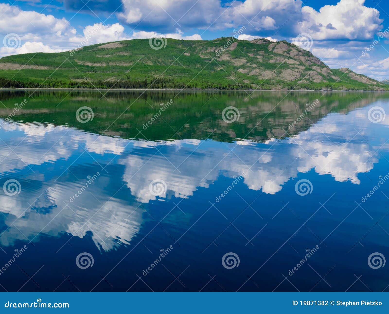 Yukon Wilderness Reflected on Calm Lake Stock Photo - Image of clouds ...