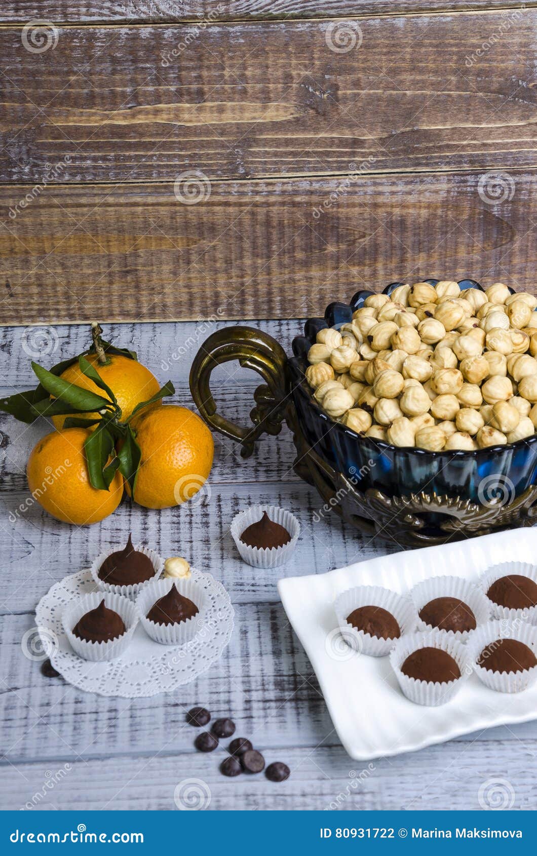 Yummy Chocolate Sweets with Hazel Nut and Tangerines Stock Photo ...