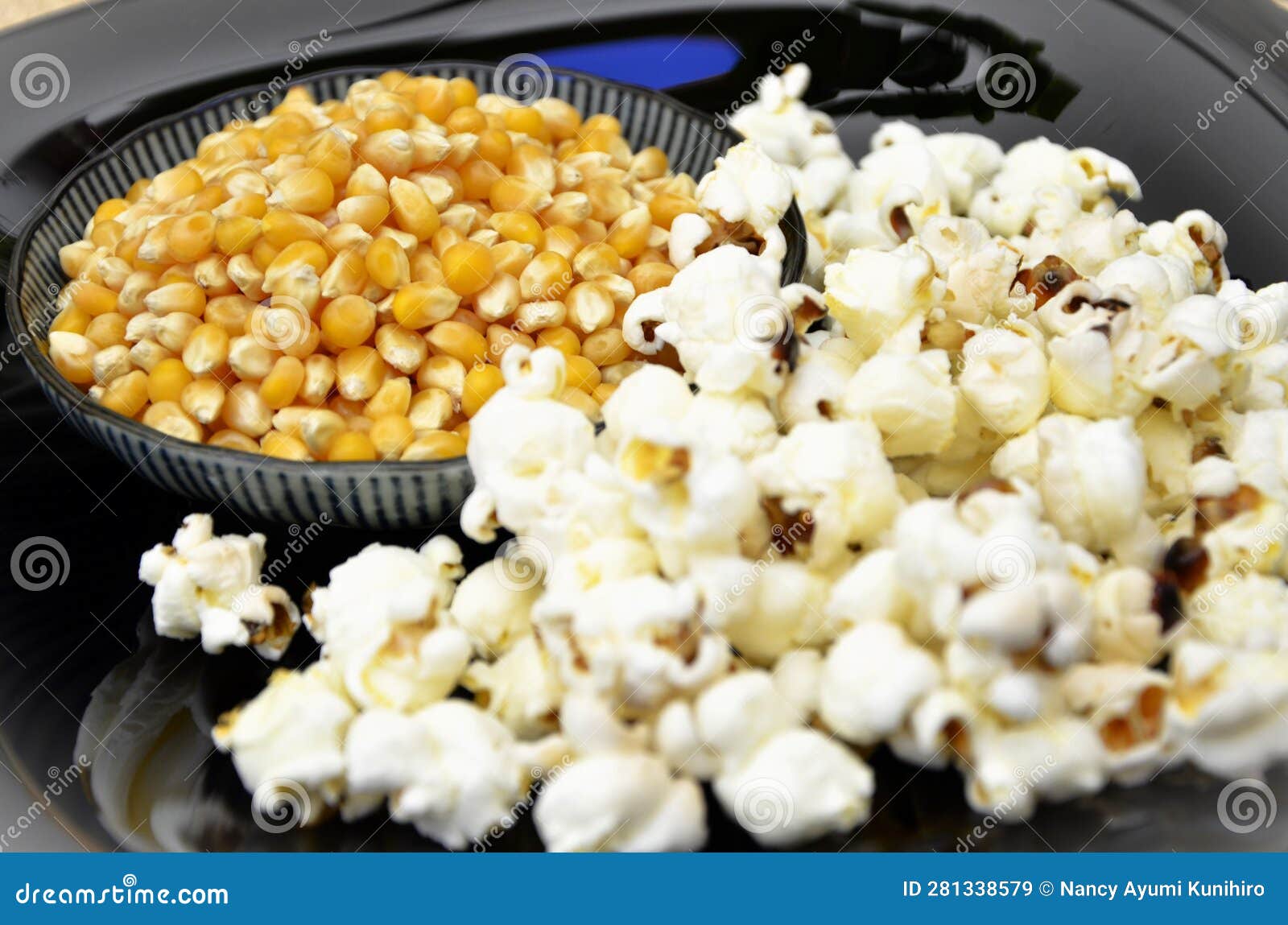 The Corn on the Plate and the Popcorn Ready on the Plate Stock Image ...