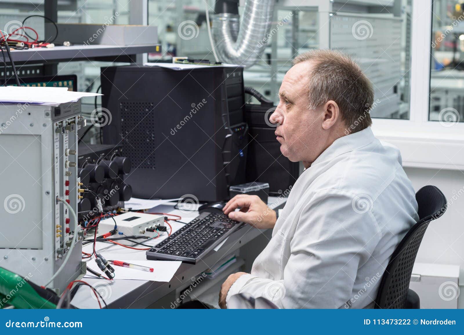 The Engineer Conducts a Test of the Finished Electronic Modules ...