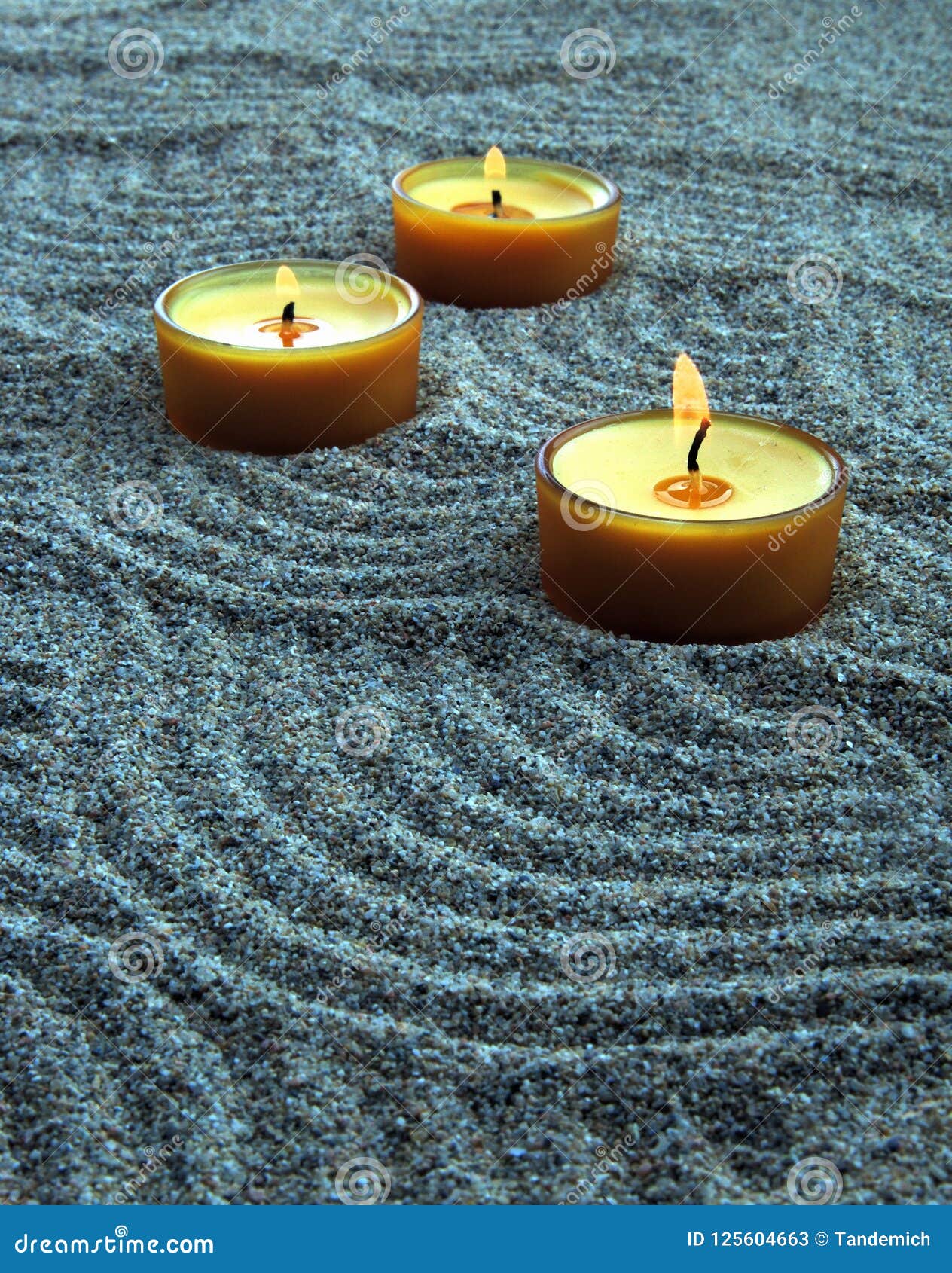 Candles in the Sand. Calming Patterns on the Sand Stock Image - Image ...