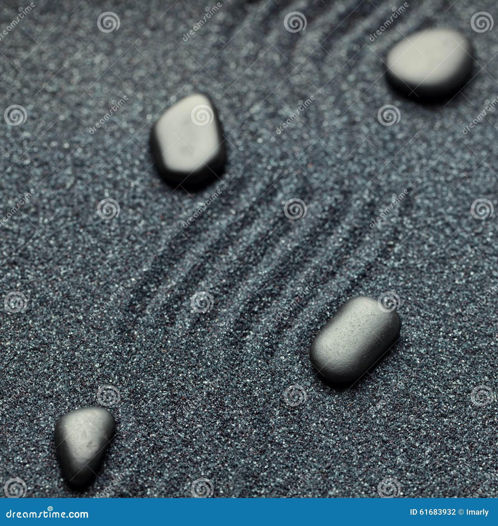 Zen Garden with a Wave Lines in the Sand with Black Stones Stock Photo ...