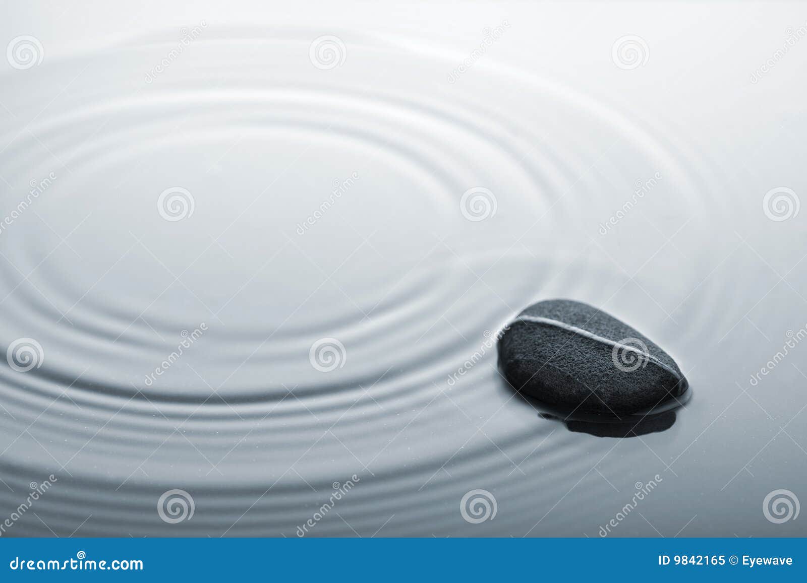 Zen stone in rippled water stock image. Image of blue - 9842165