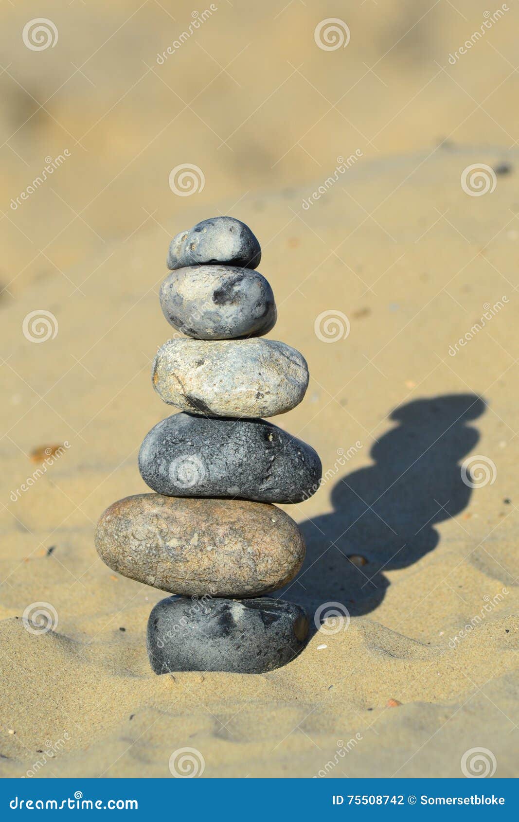 Zen stones stacked on sand stock photo. Image of stacked - 75508742