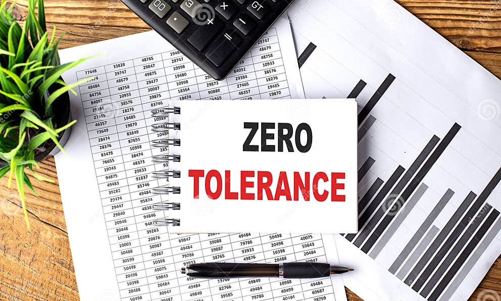 ZERO TOLERANCE Text on a Notebook with Chart and Calculator Stock Photo ...