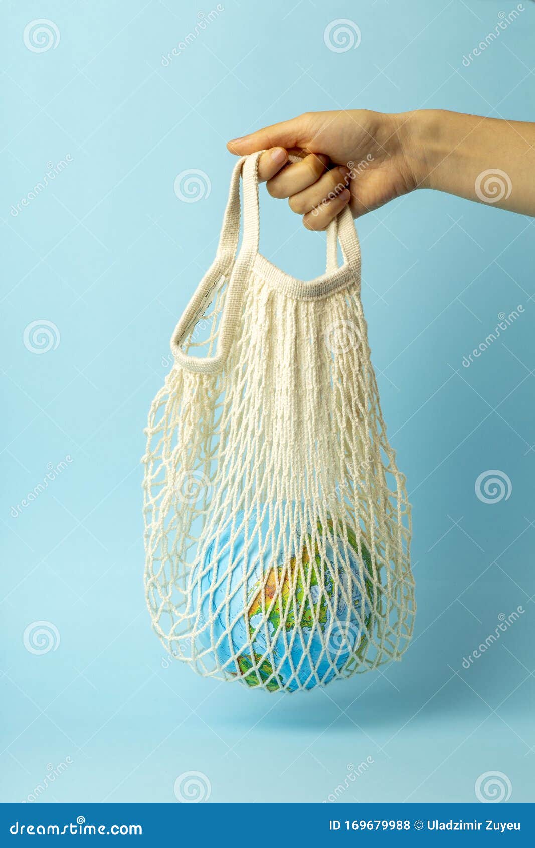 Zero Waste Concept. String Bag in a Female Hand with Earth Globe Stock ...