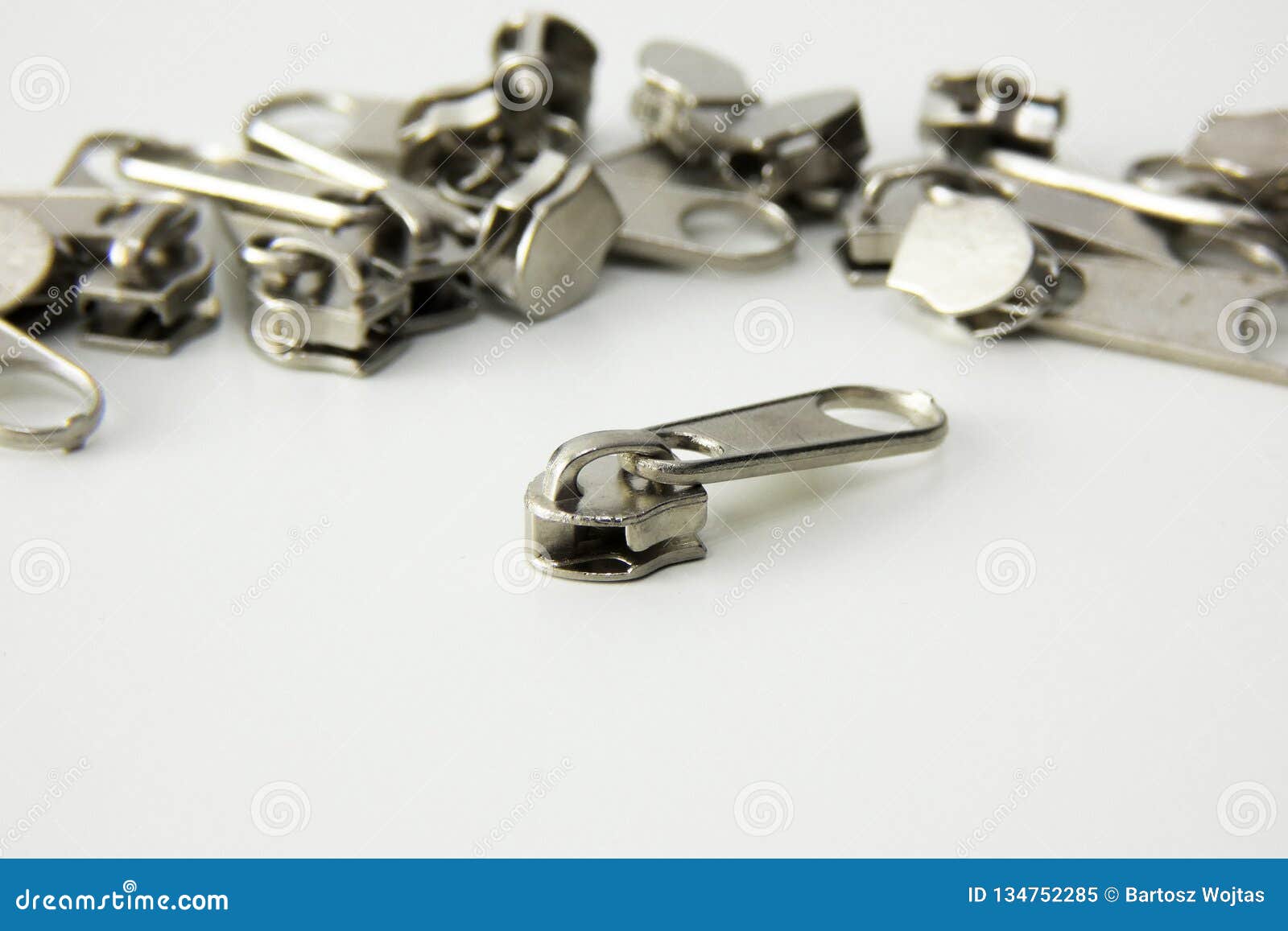 Zip Fastener with Group of Sliders in the Background Stock Image ...