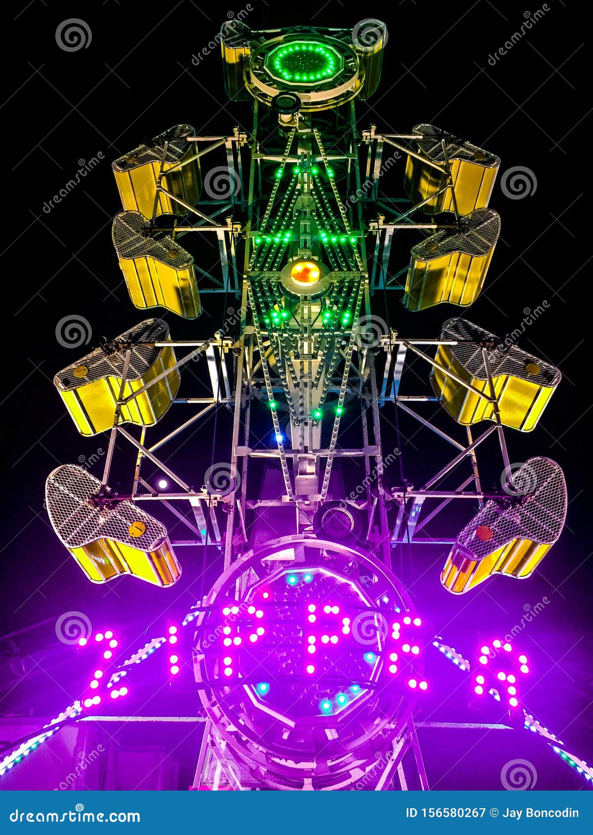 The Zipper Attraction Glowing Amidst the Nighttime Sky. Stock Image ...