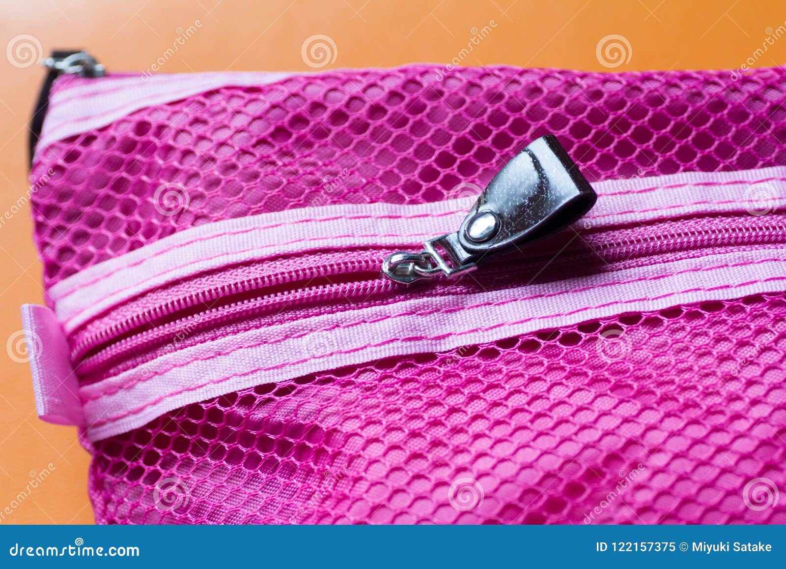 Zipper on pink pouch stock image. Image of symbol, close - 122157375