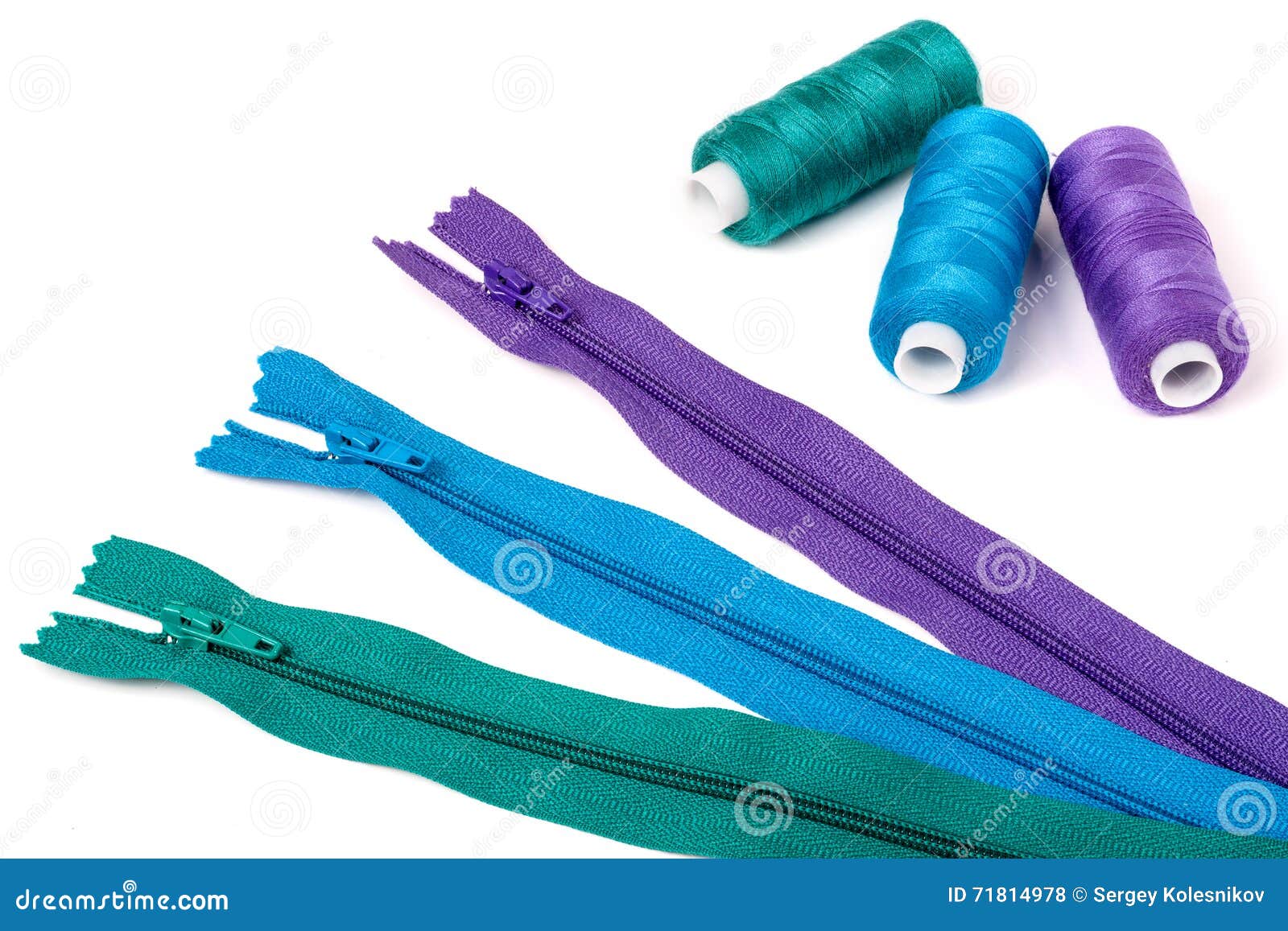 Zipper with a Spool of Thread Isolated on White Background Stock Photo ...