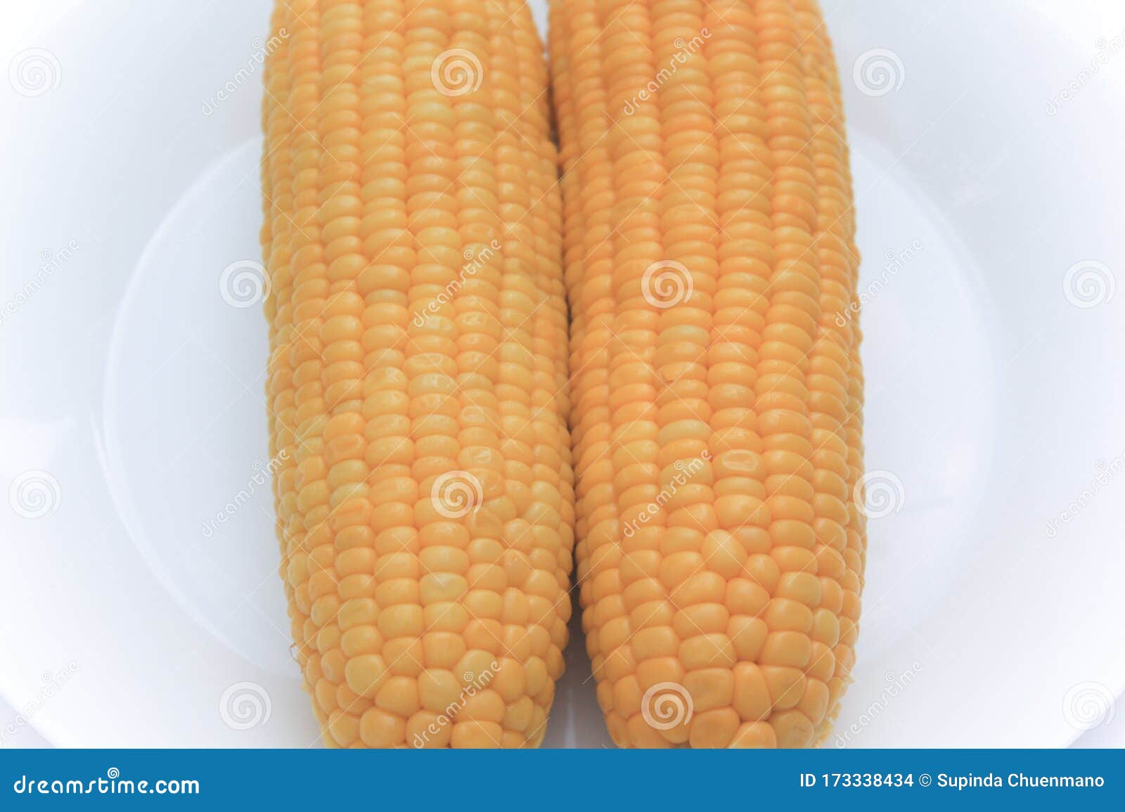 Zooms on the Corn Placed on a White Plate Stock Photo - Image of green ...